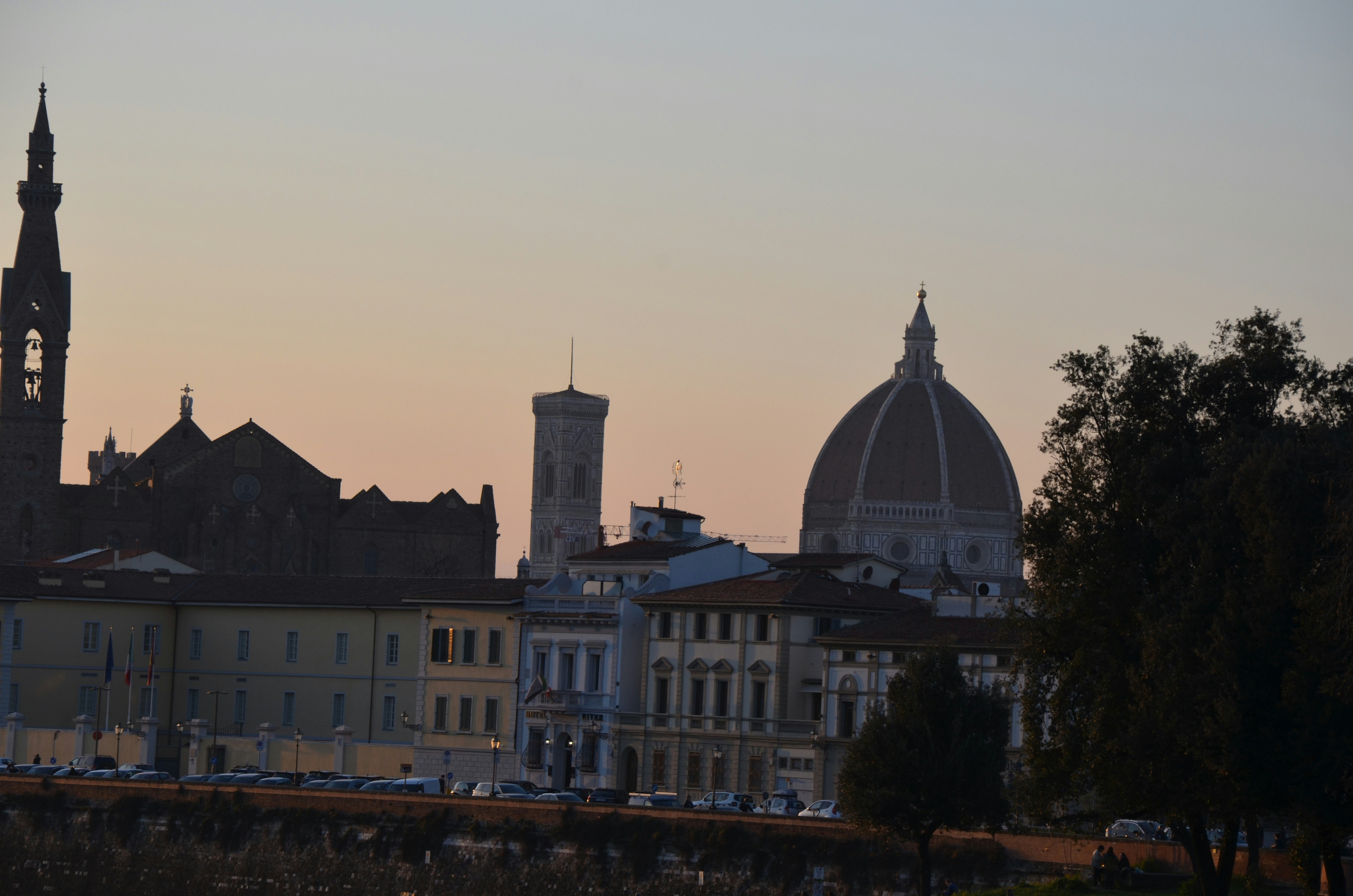Dusk Over Florence: The Duomo Silhouette Framing the Arno