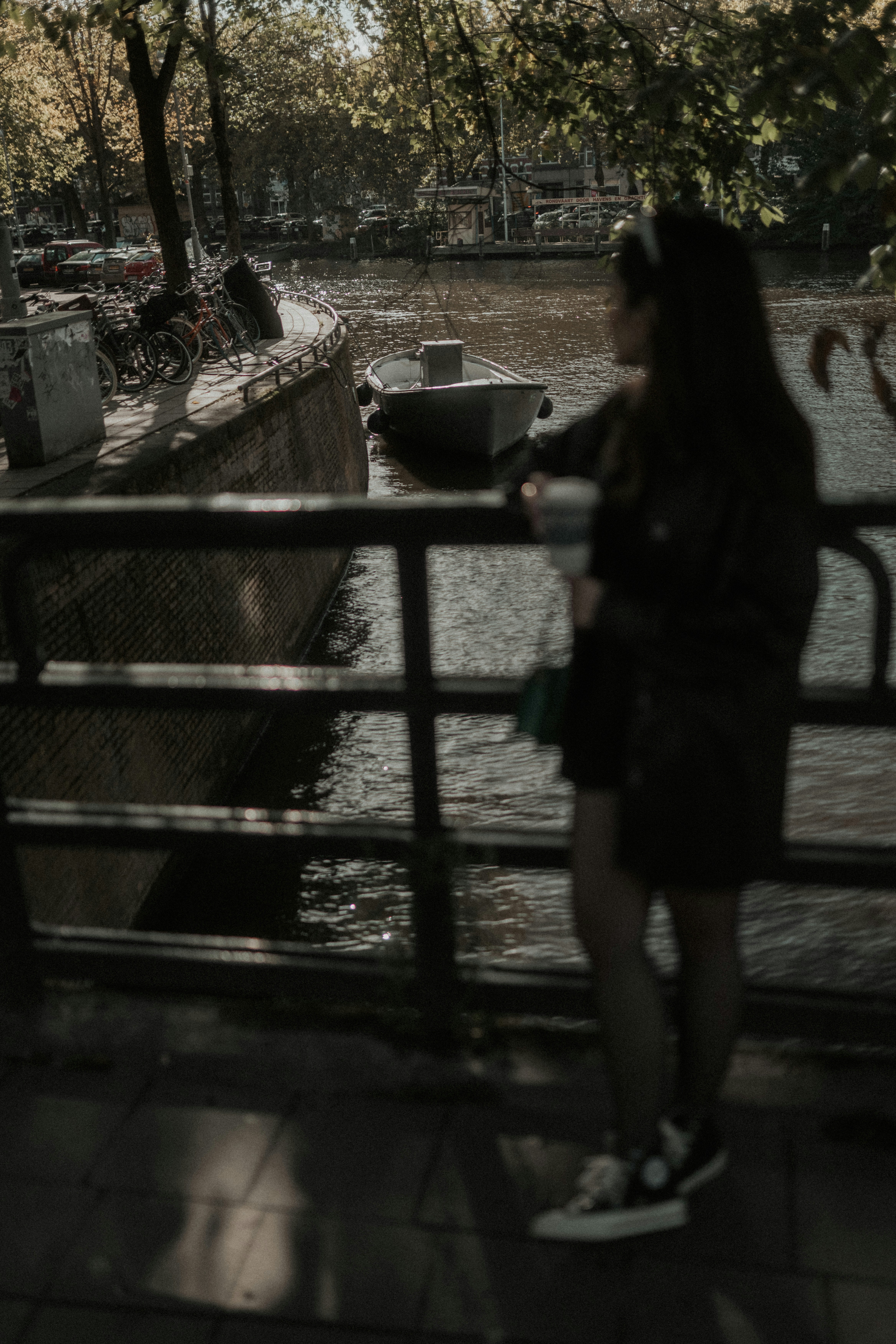Dappled Light Over a Canal Bridge: Quiet Moment by the Waterway