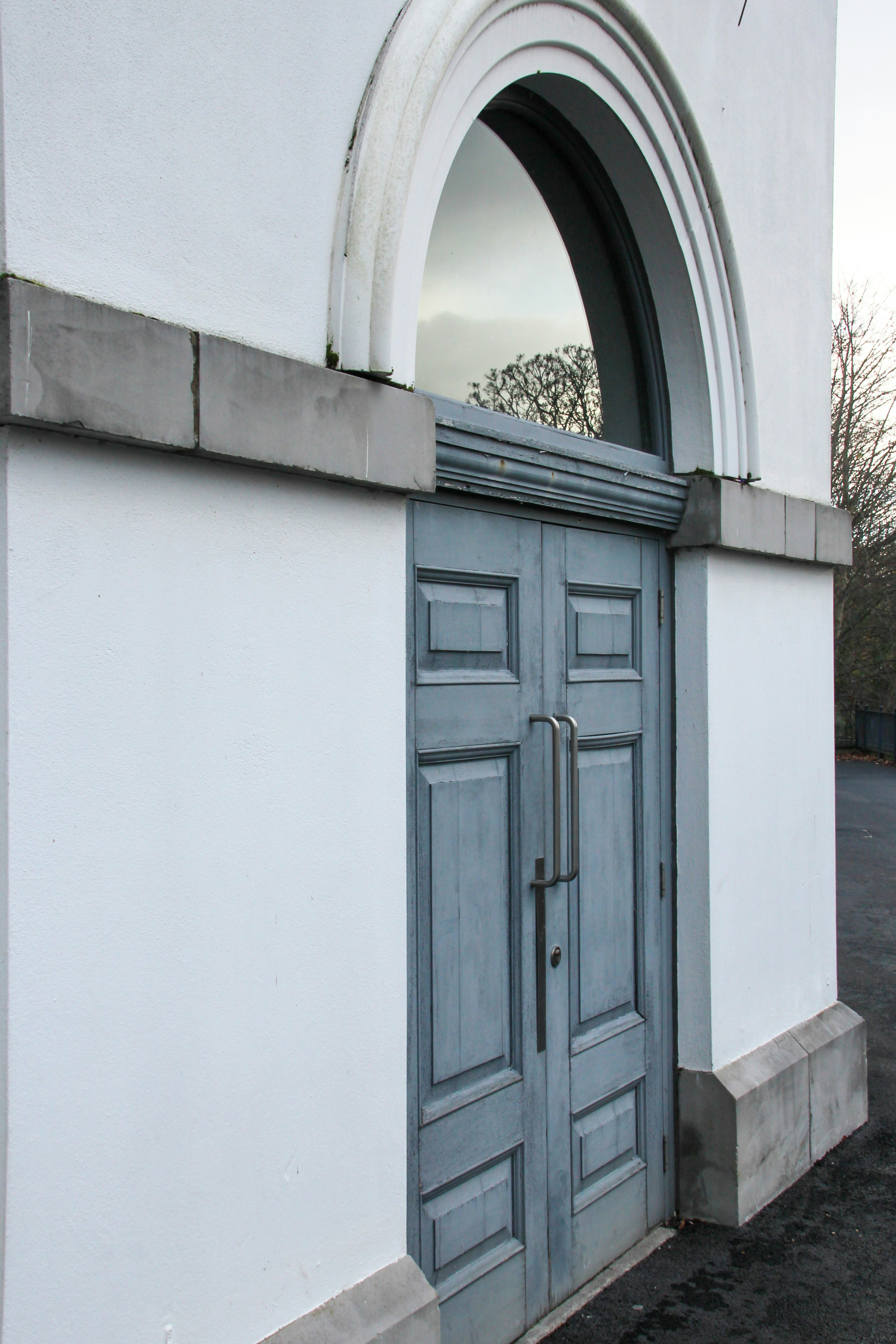 Weathered Blue Double Door Under Archway