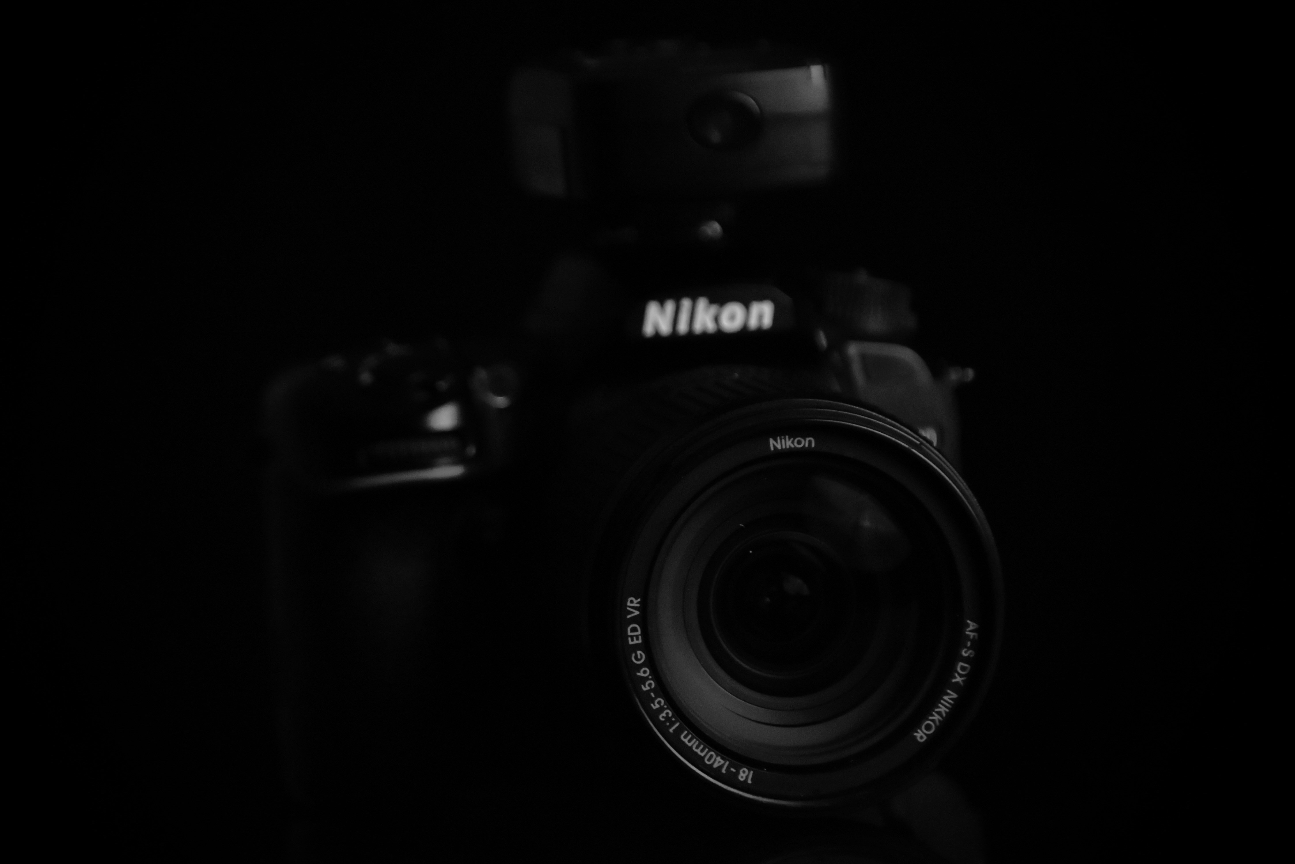 a black camera with a lens