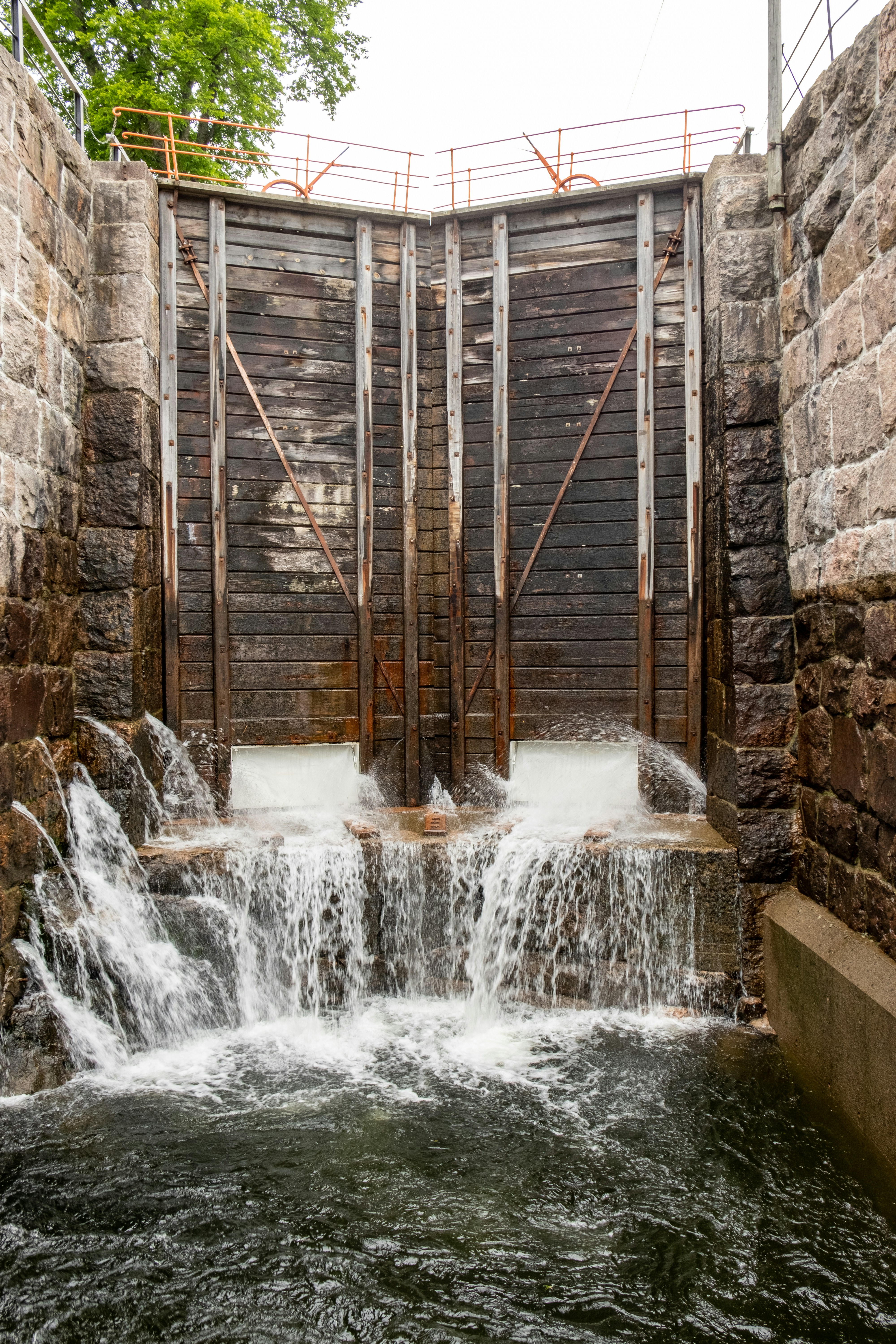 Cascading Gate at the Old Lock: Water Between Stone and Timber