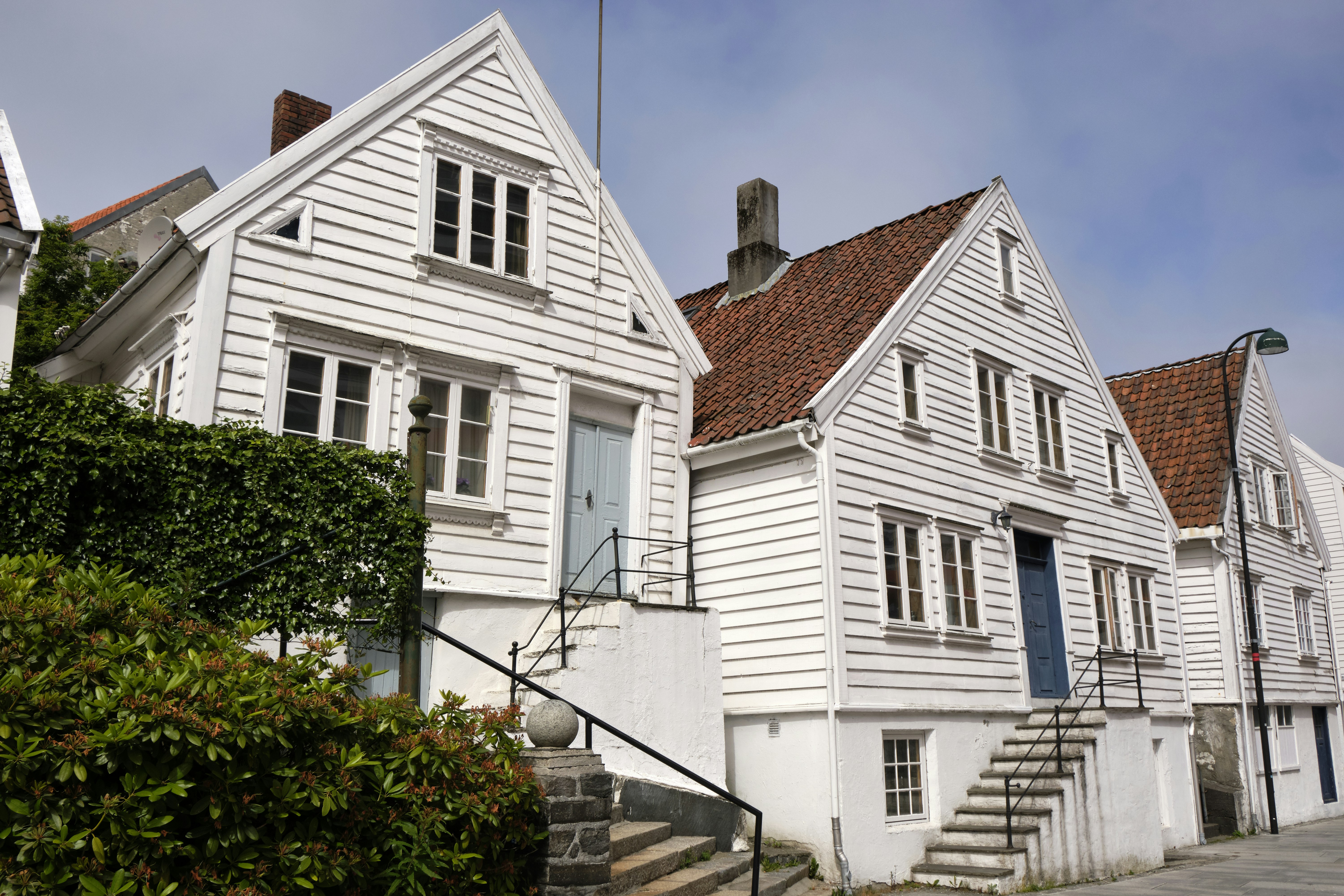 Blue Door, White Facades: A Quiet Row of Gabled Houses