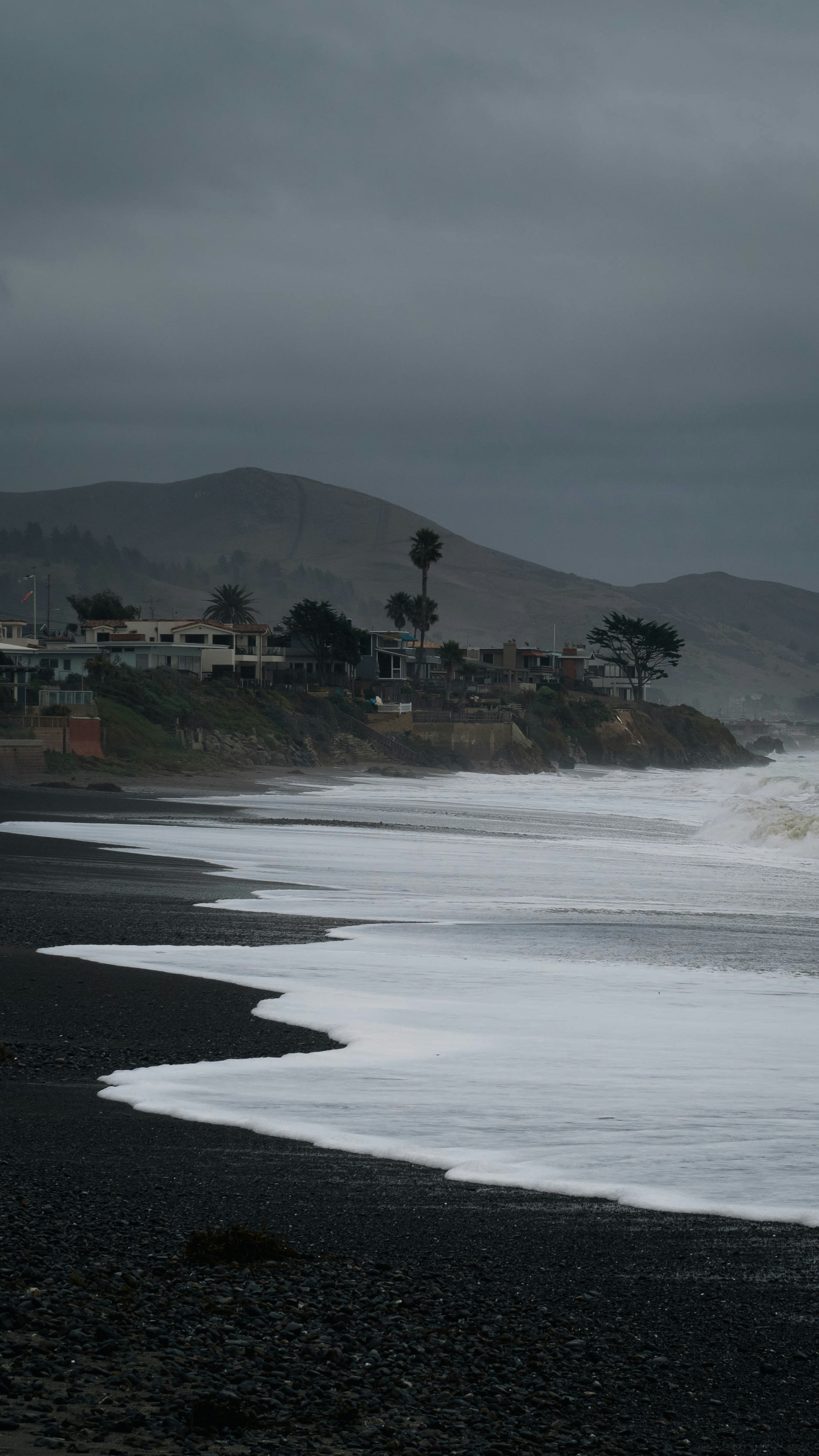 a beach with waves crashing on it