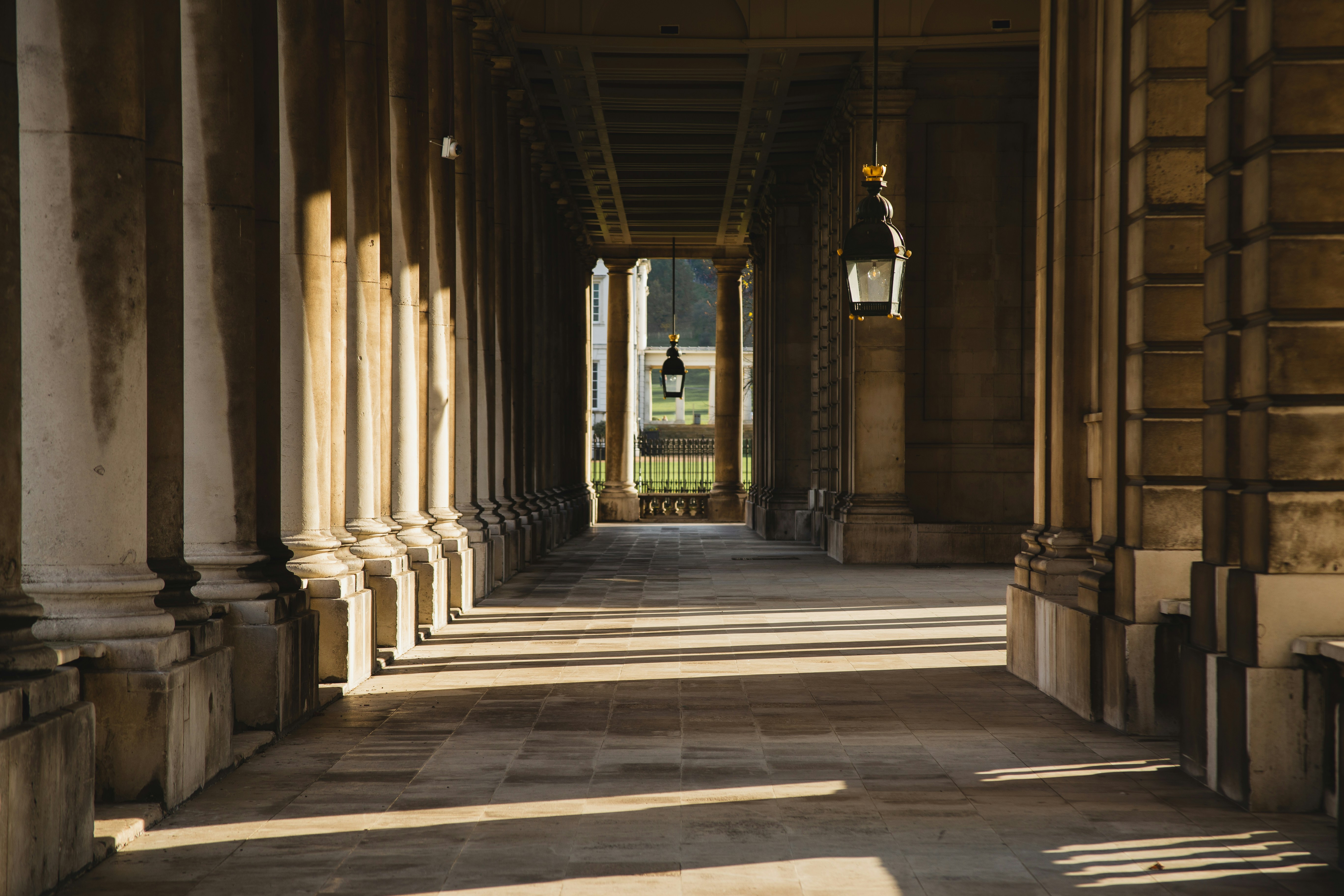 A hallway with columns and a gate photo – Free University of greenwich ...