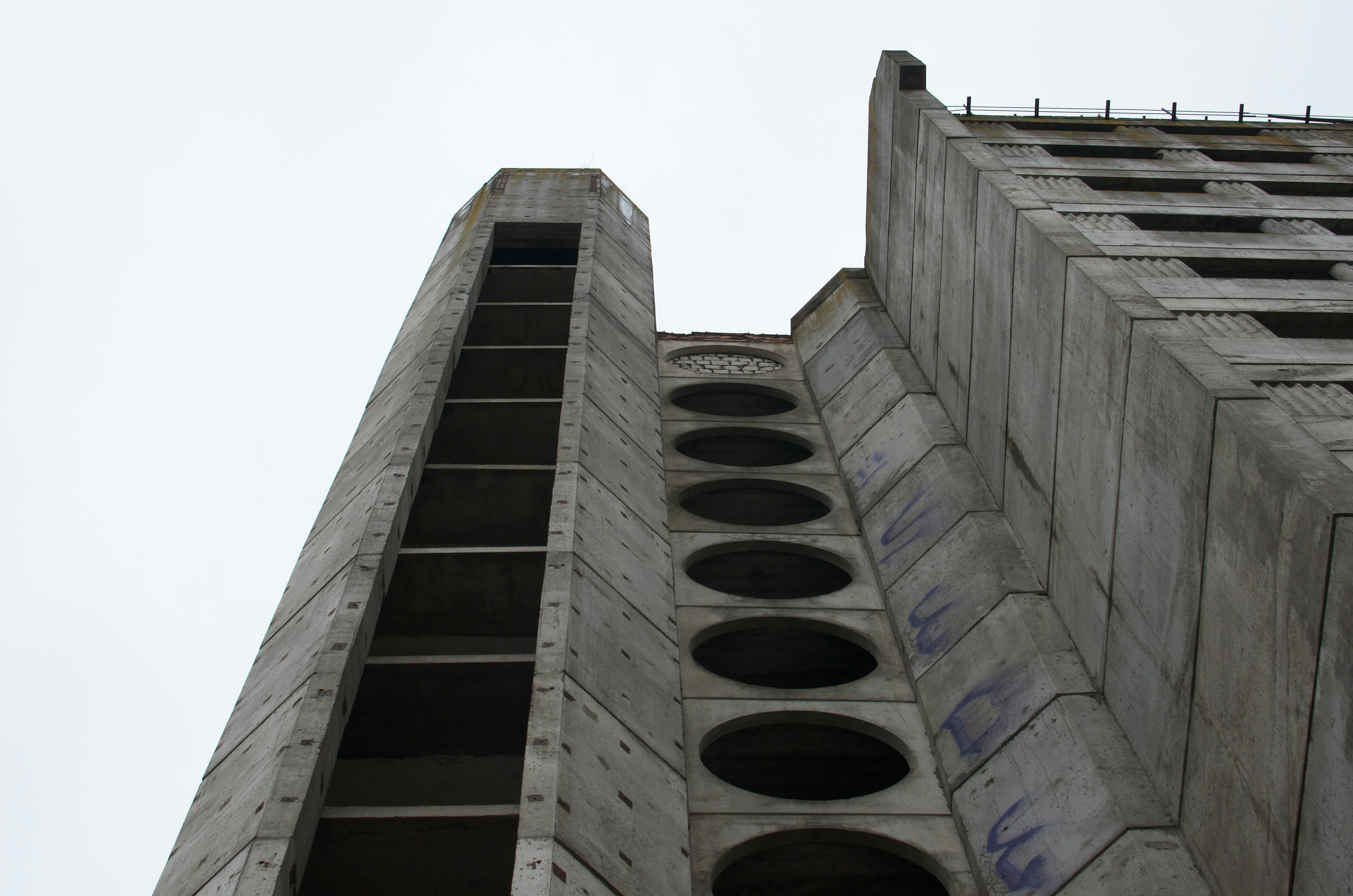 Concrete Monoliths: A Vertical Fracture of Circles and Cracks
