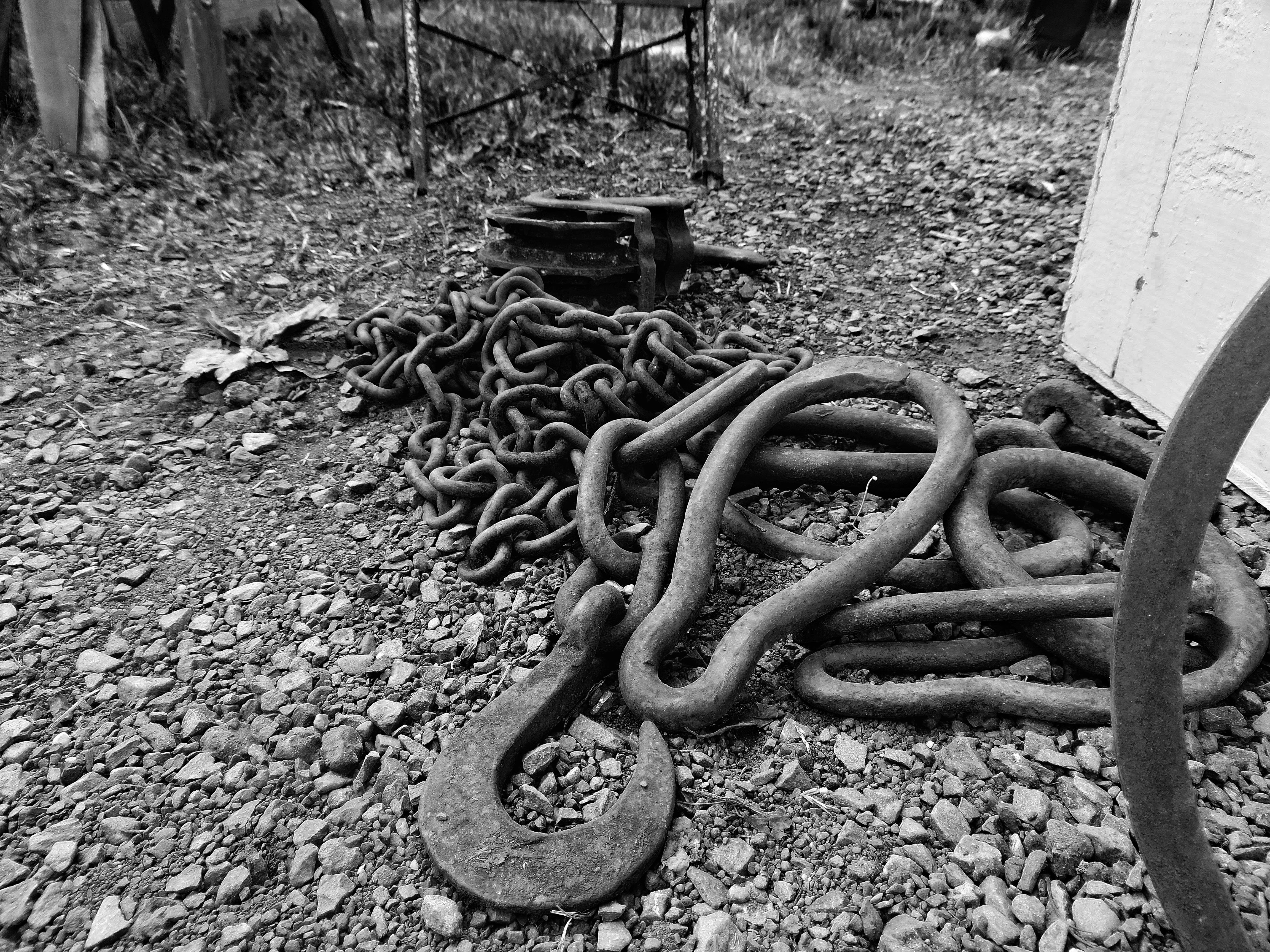Entangled Chains on Gravel: A Close-Up of Weathered Links