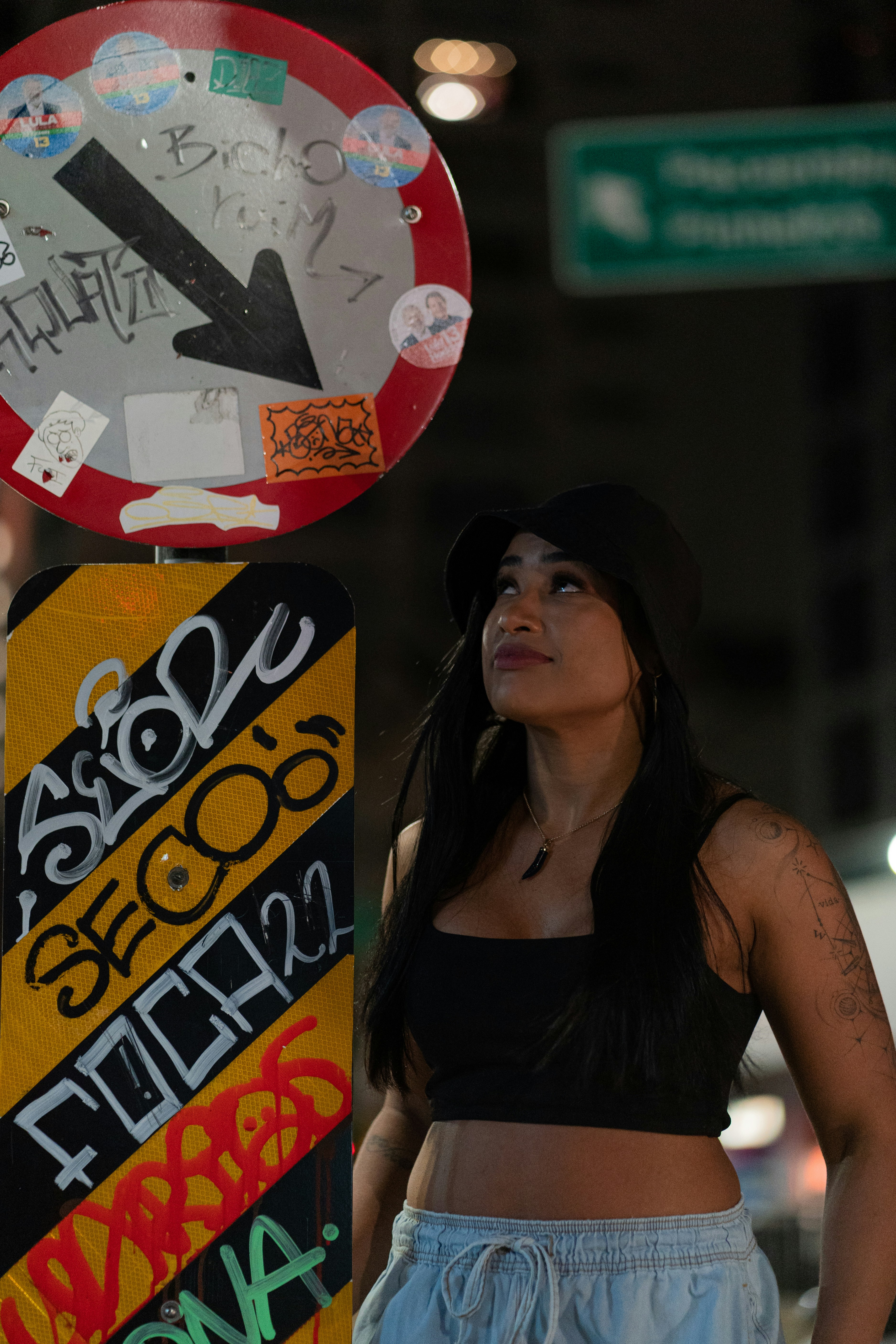 A person standing next to a sign photo – Free Sticker Image on Unsplash