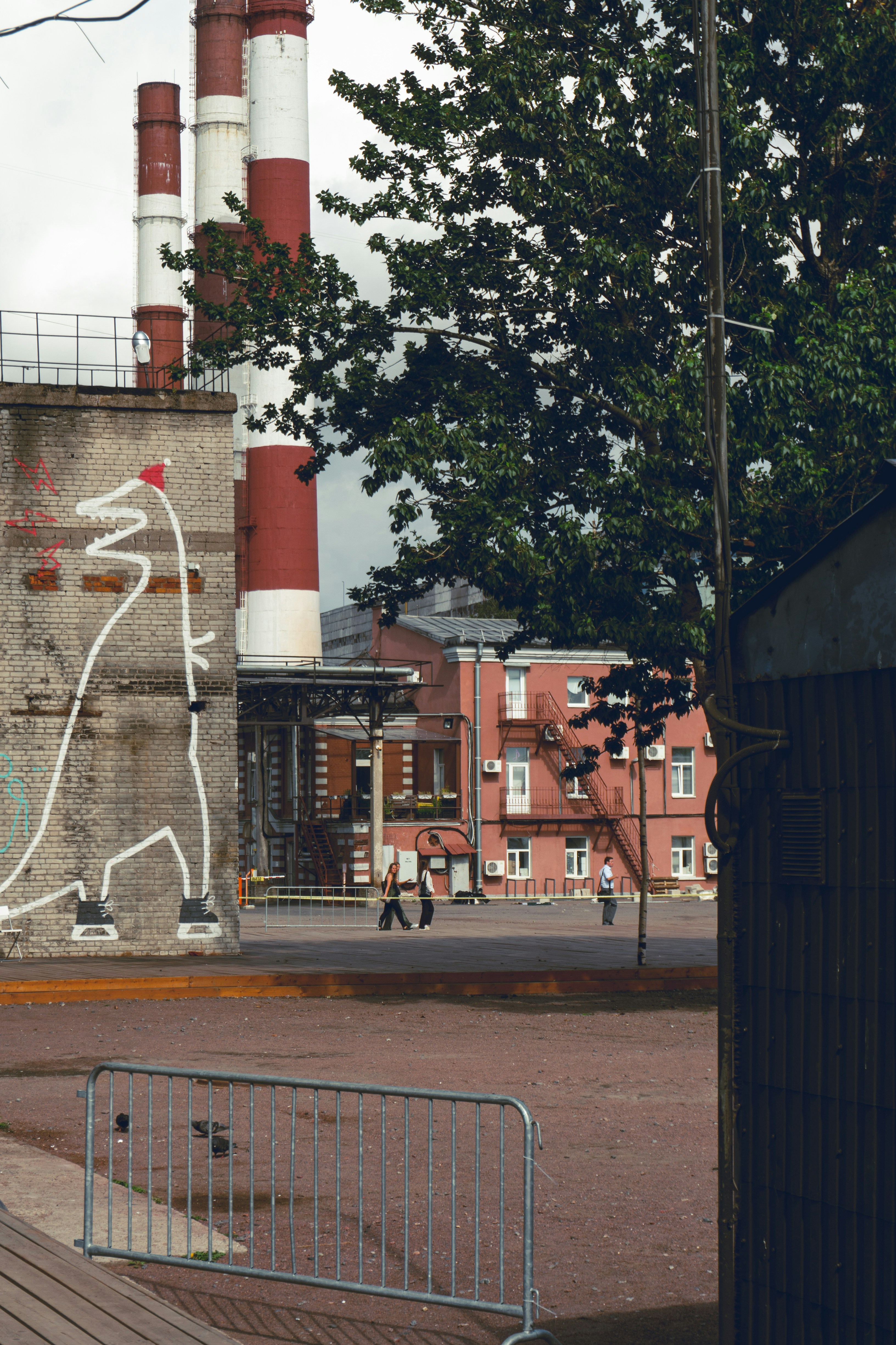 Industrial Echoes: A Quiet Moment Amid Chimneys and Graffiti