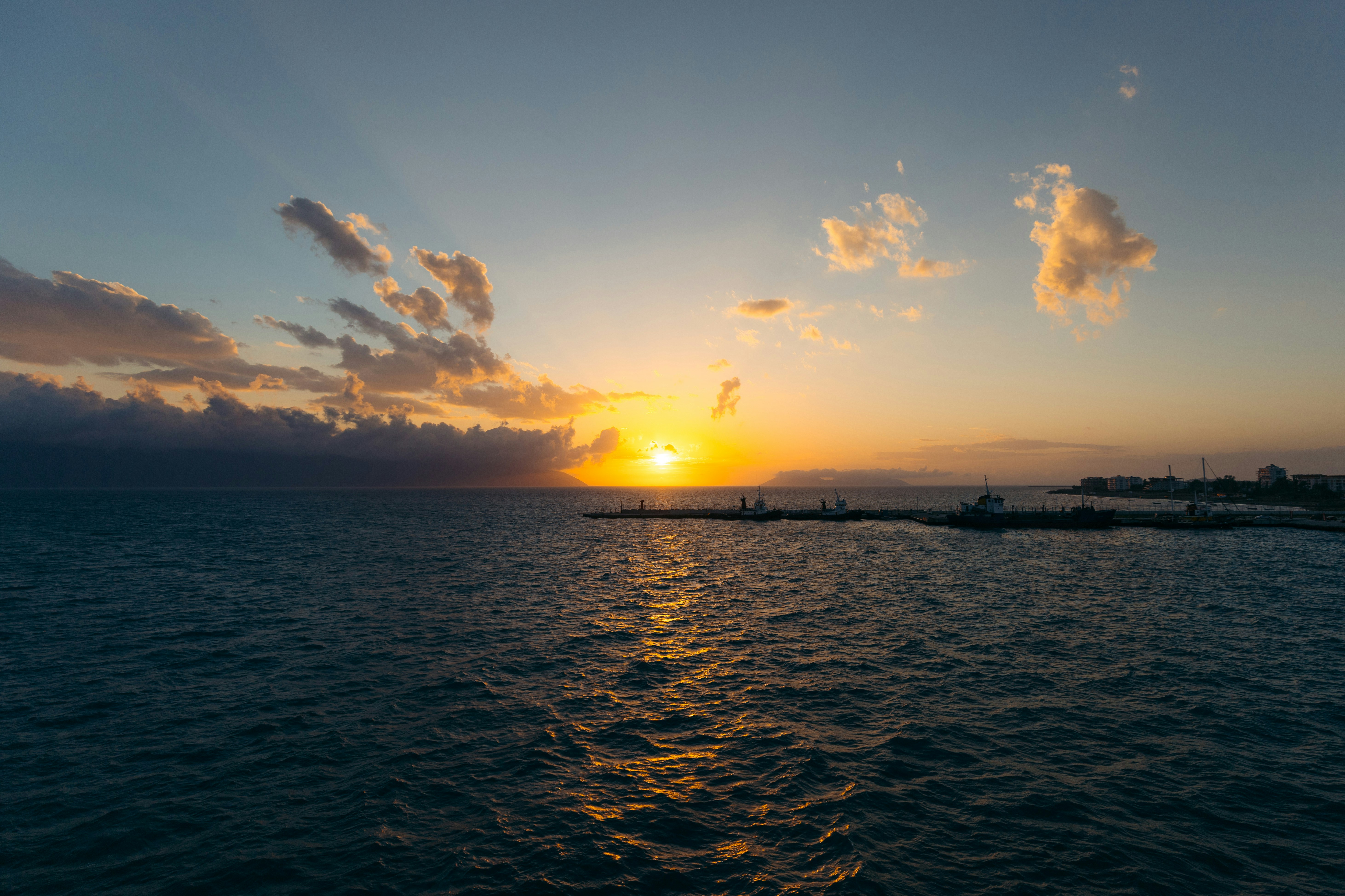 a sunset over a body of water