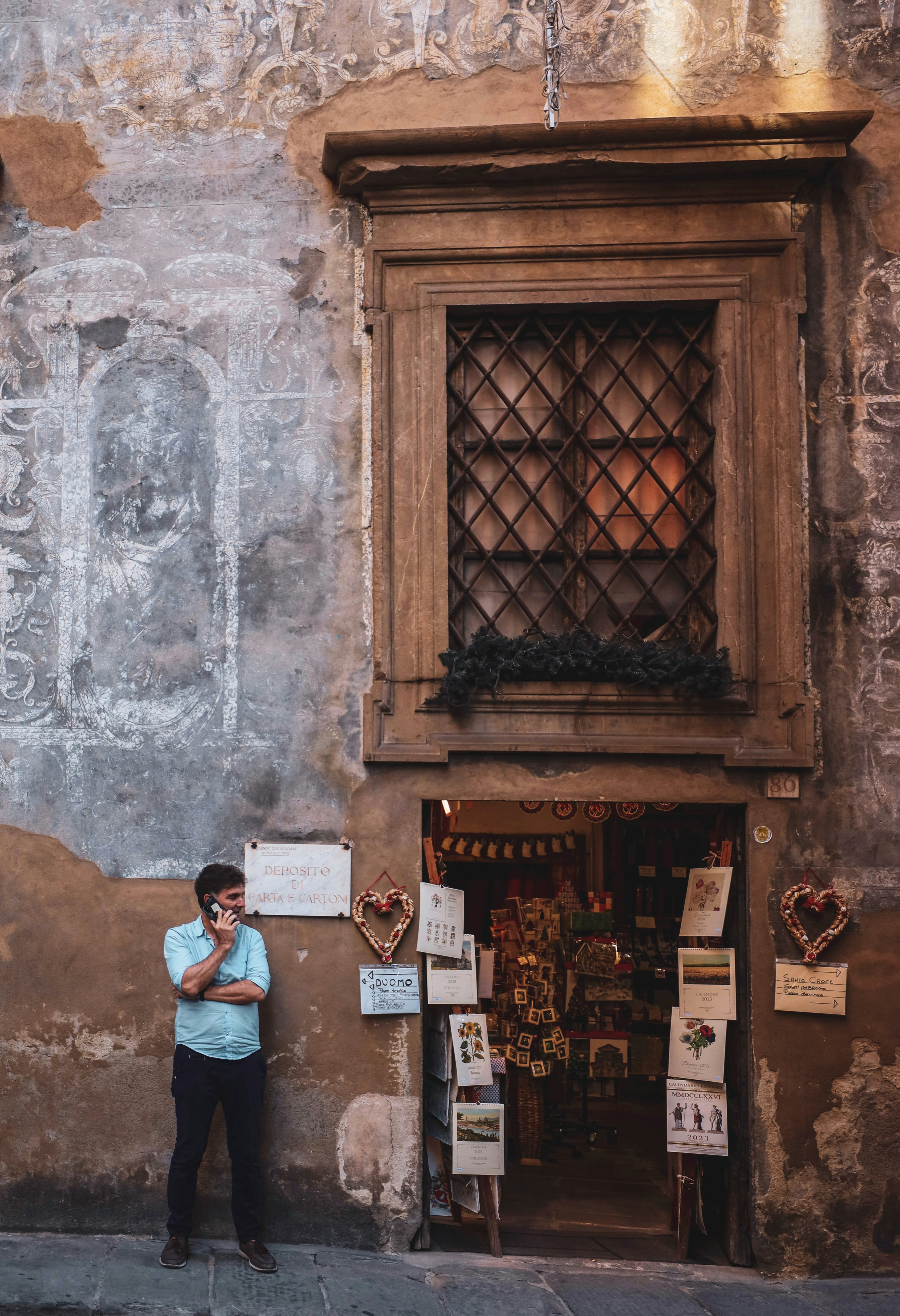 Urban Contemplation by a Rustic Storefront