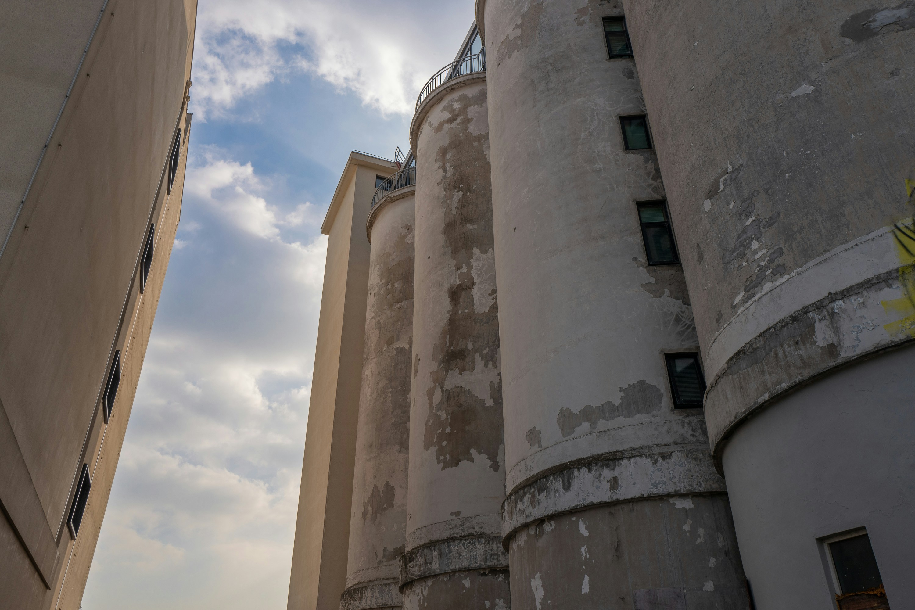 Weathered Cylinders Against a Pale Sky: An Urban Concrete Portrait
