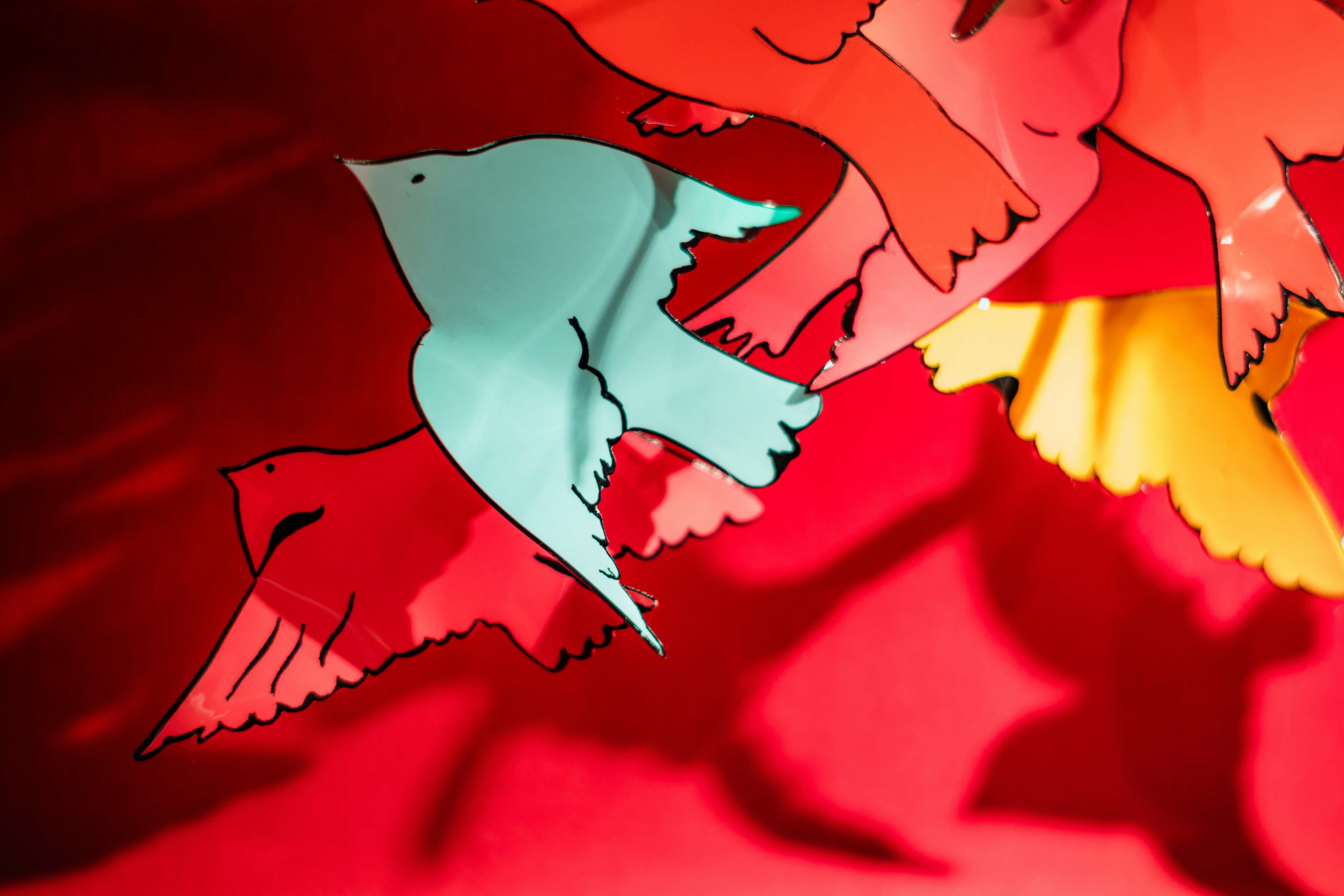 Turquoise Doves Drift Across a Crimson Canvas