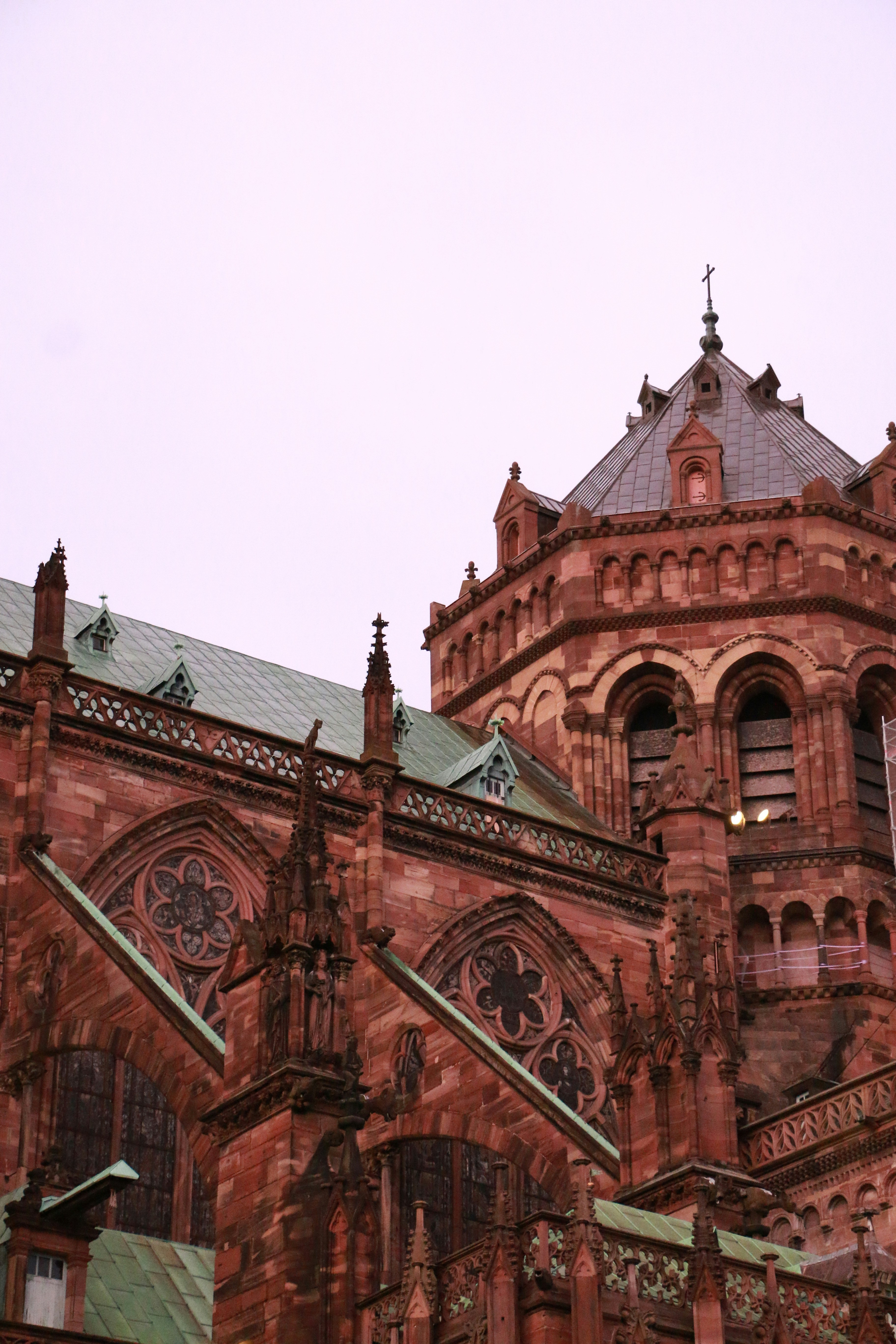 Ornate gothic architecture of the Strasbourg Cathedral with intricate stone carvings and a towering spire.