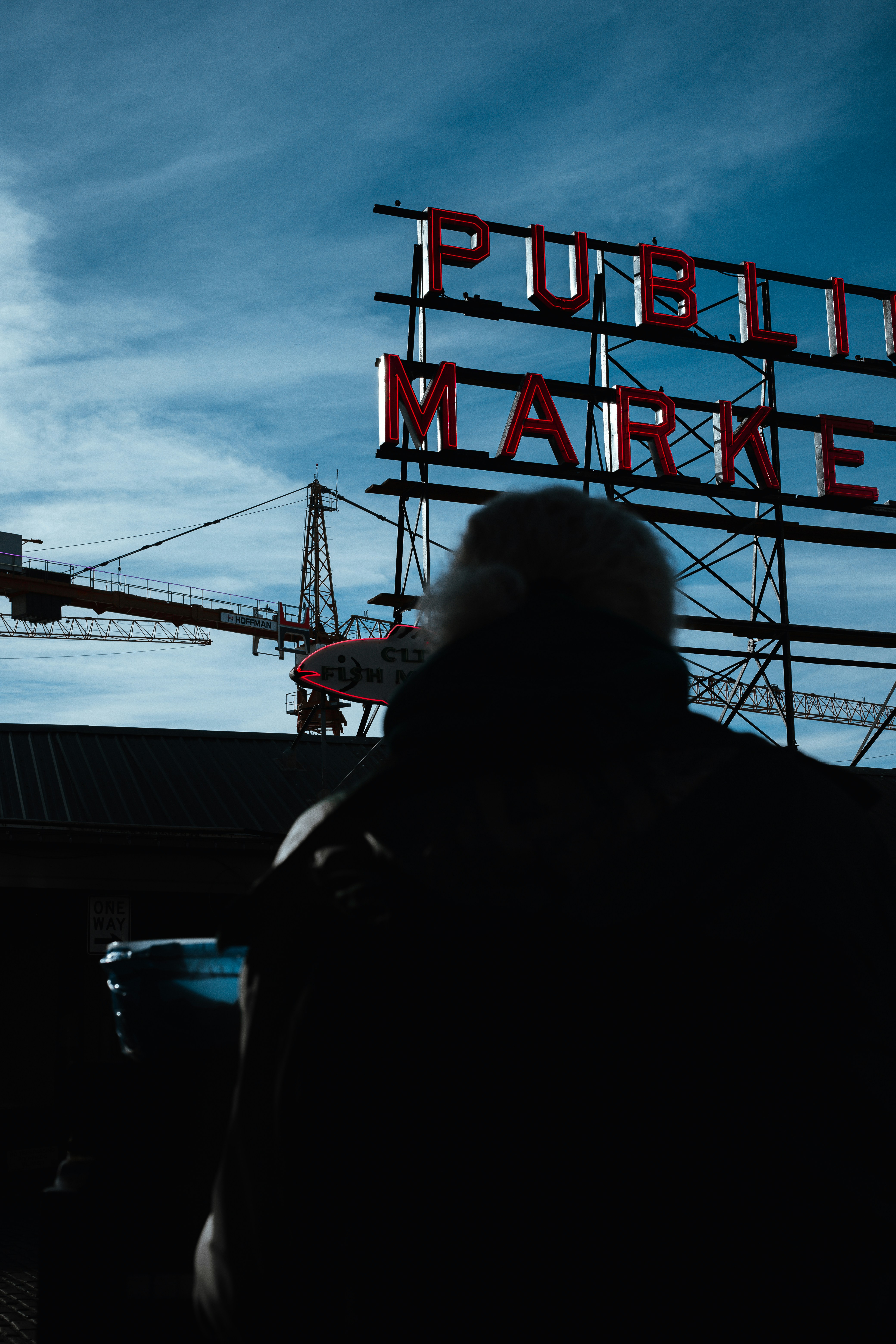 a person standing in front of a sign