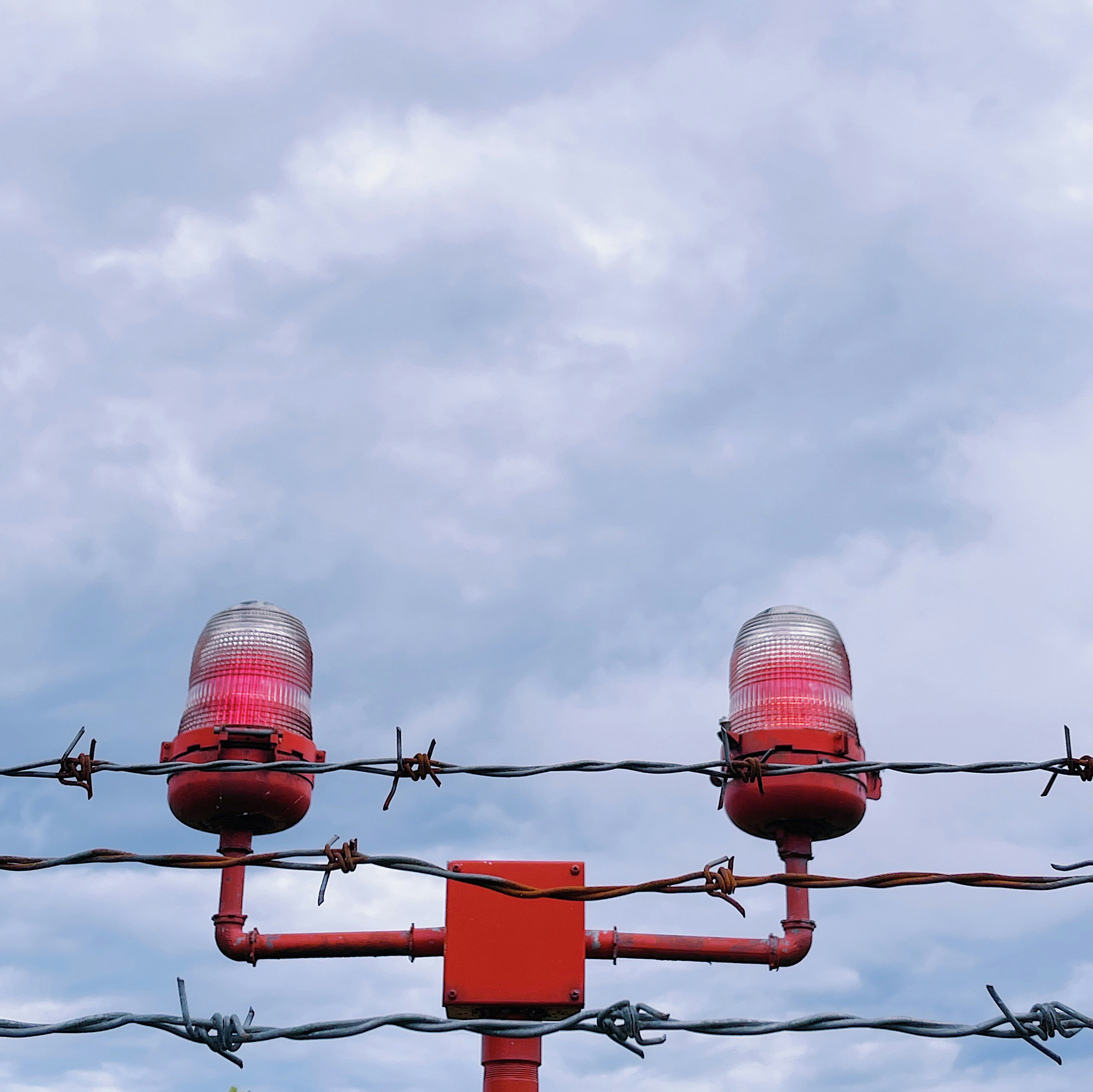 Red Beacons on a Barbed Spine