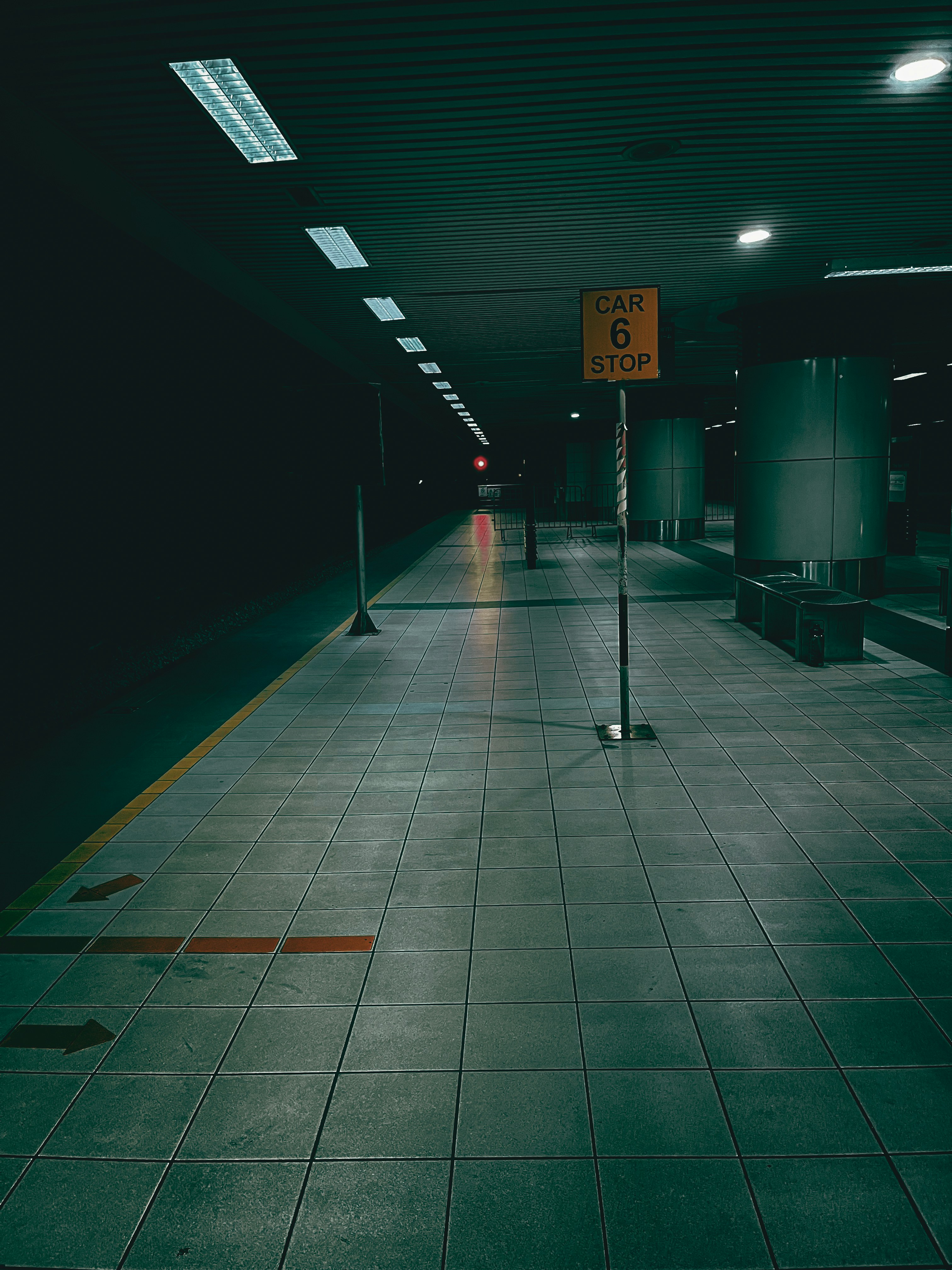 a train station with a sign