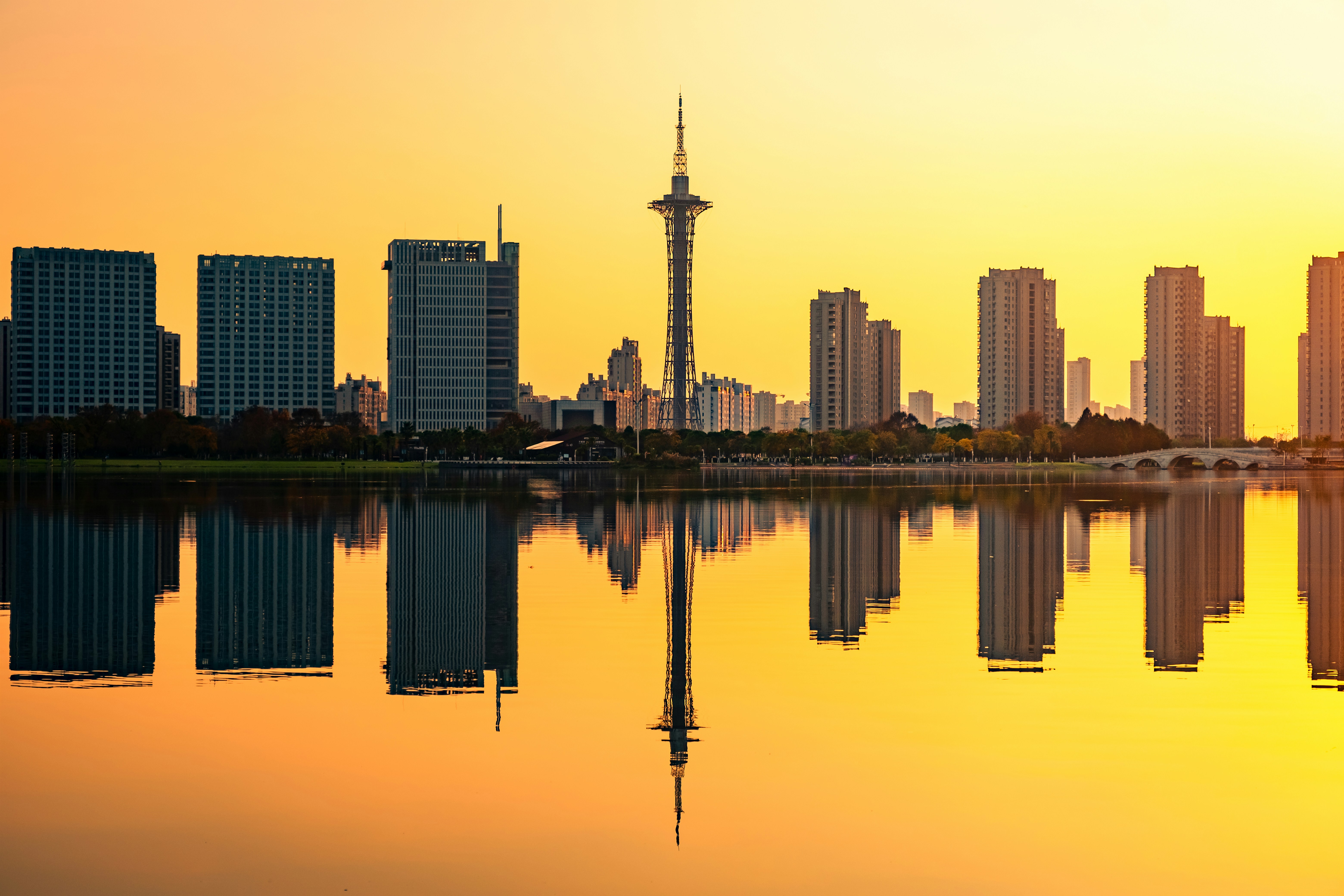 Golden Hour Spine: The Central Tower Anchors a Quiet Waterfront Skyline