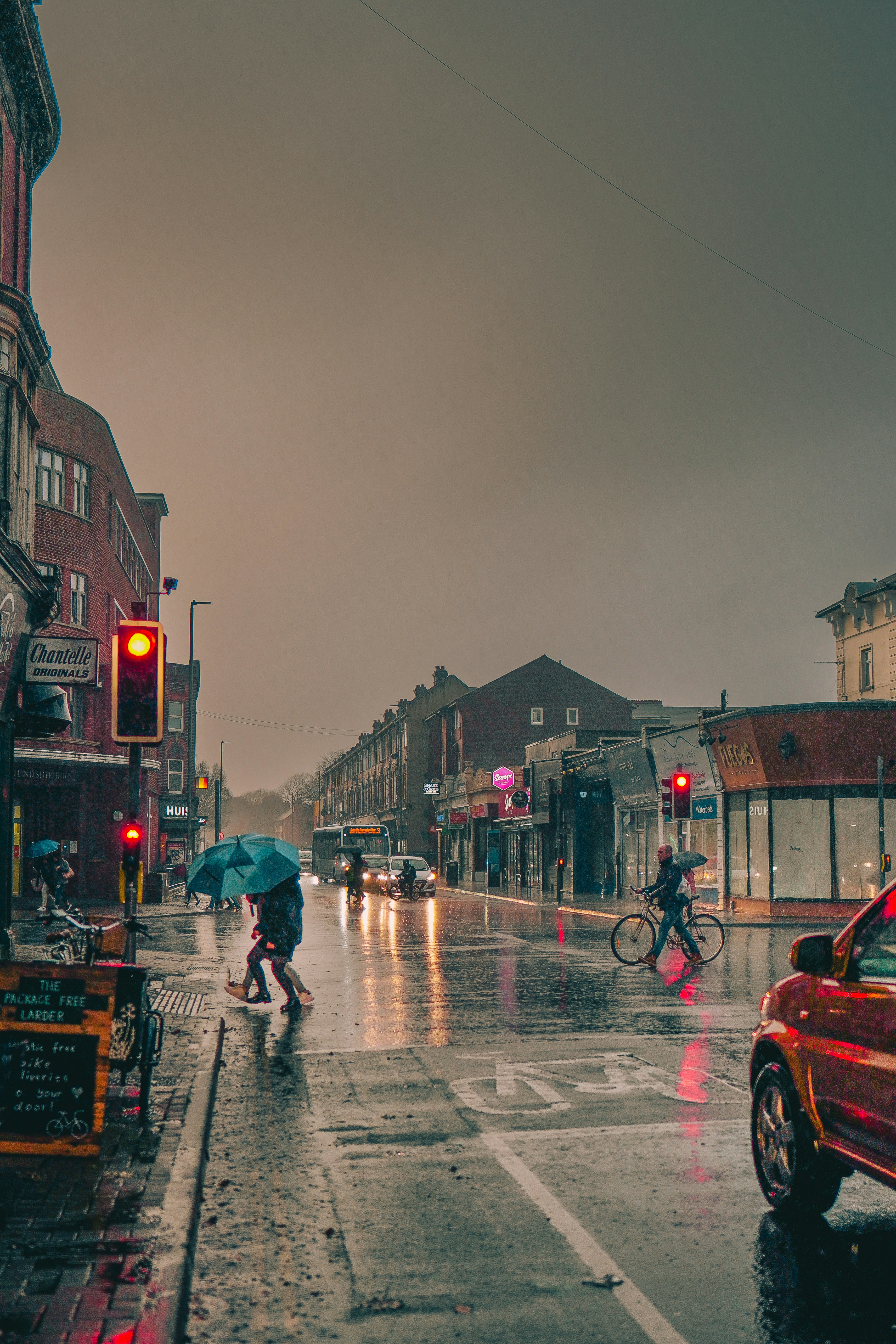 A person walking down a sidewalk with an umbrella photo – Free Albert ...