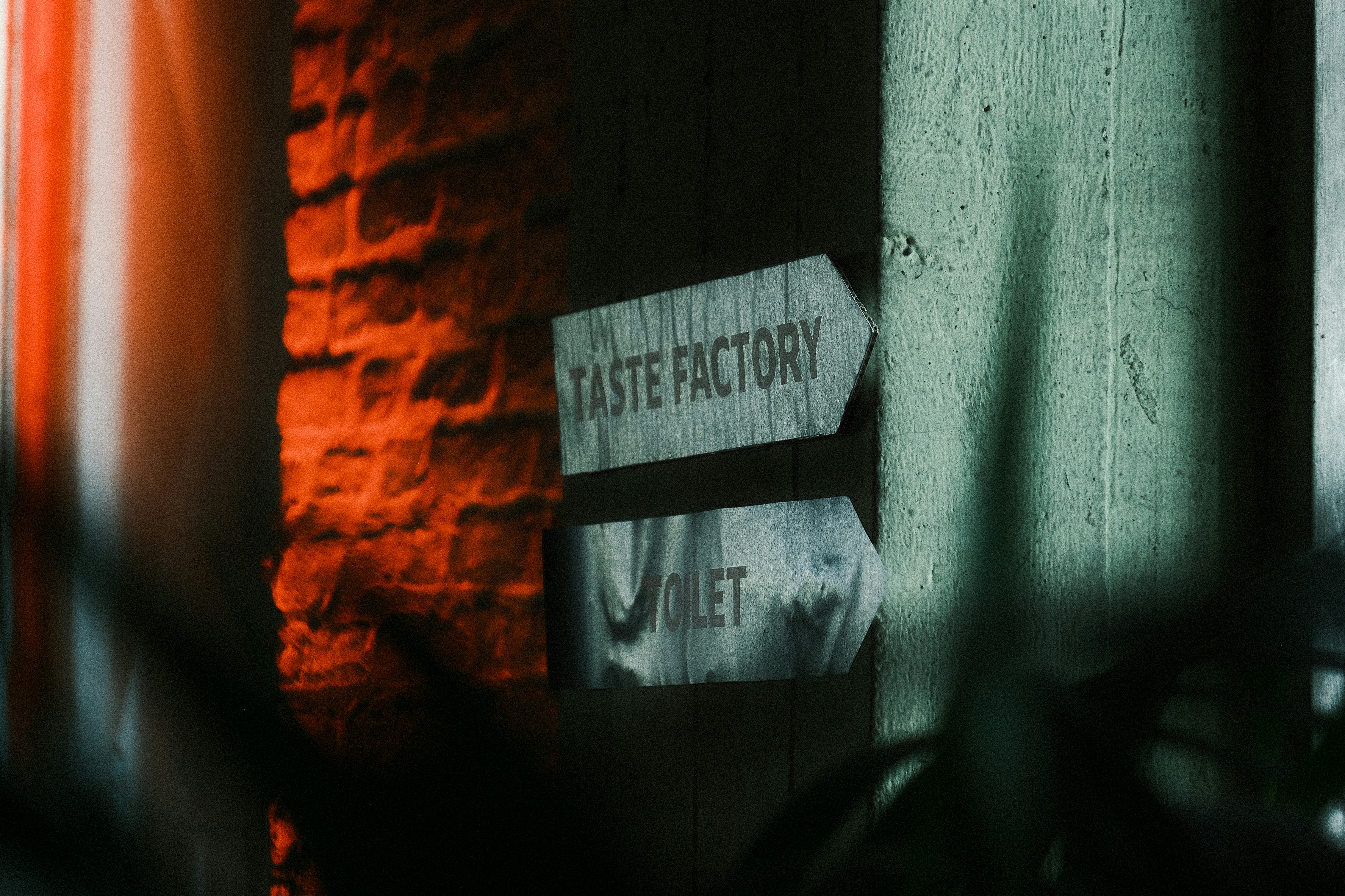 Signposts in Shadowed Corridor