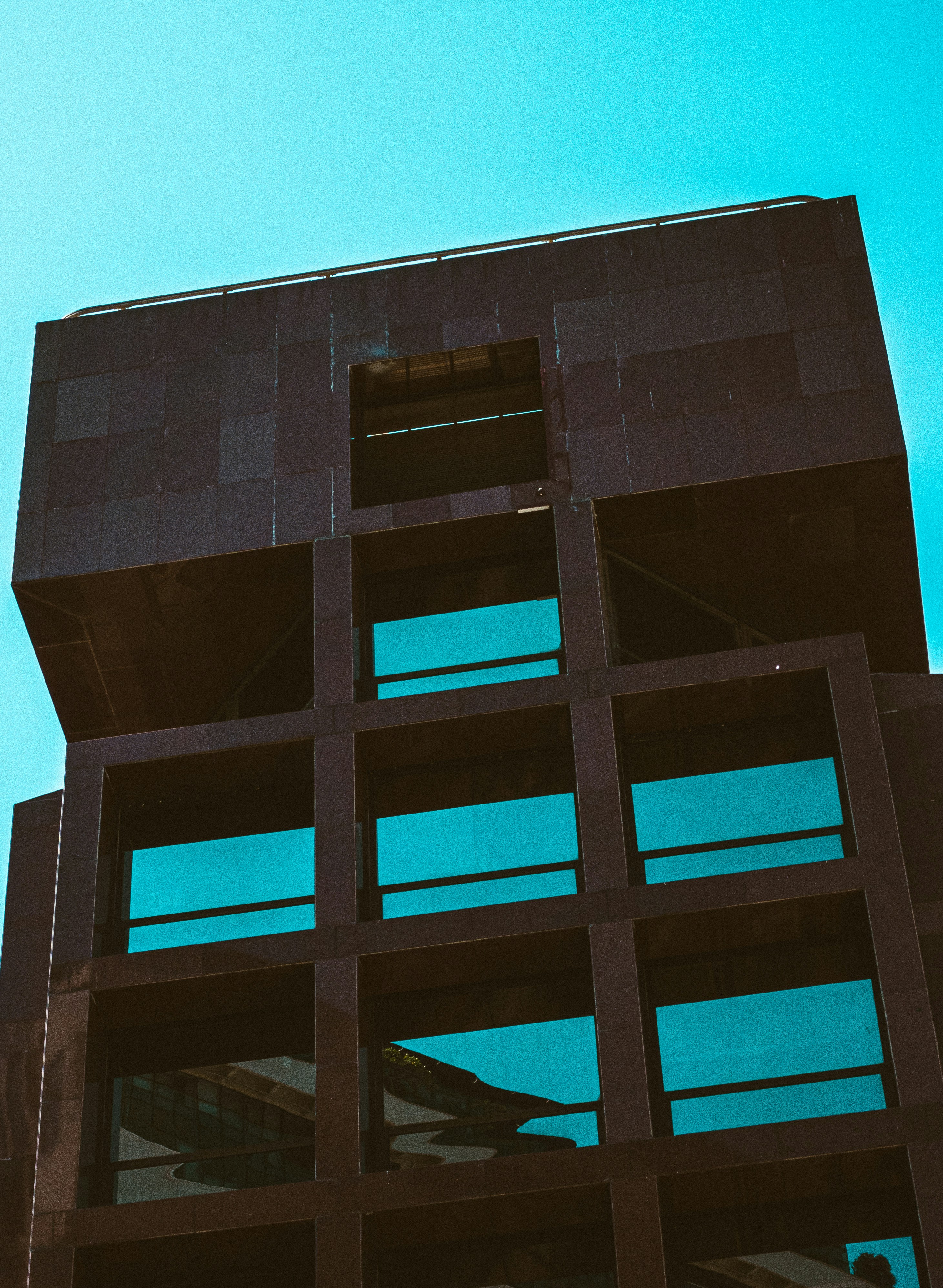 Monolithic Grid Over a Teal Sky