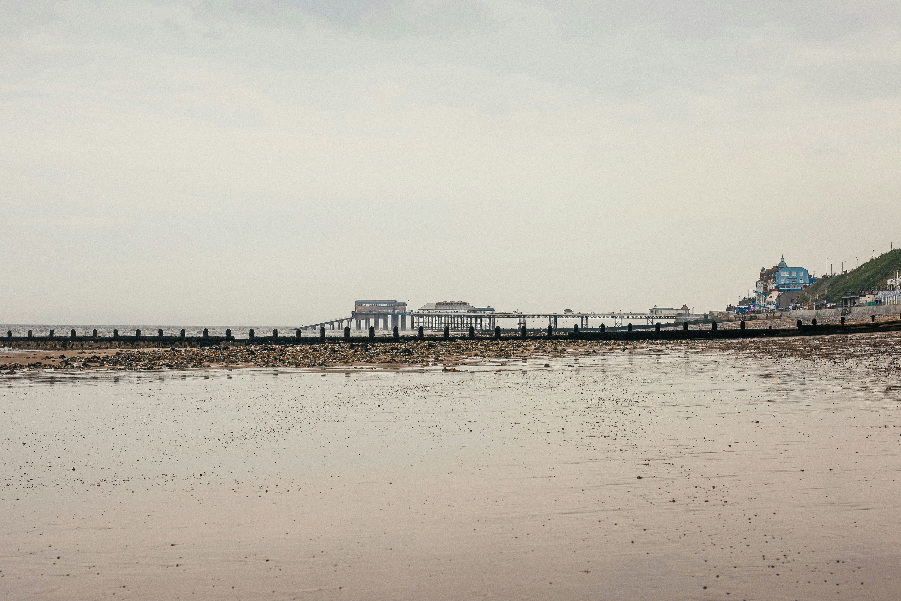 A body of water with buildings along it photo – Free Cromer Image on ...