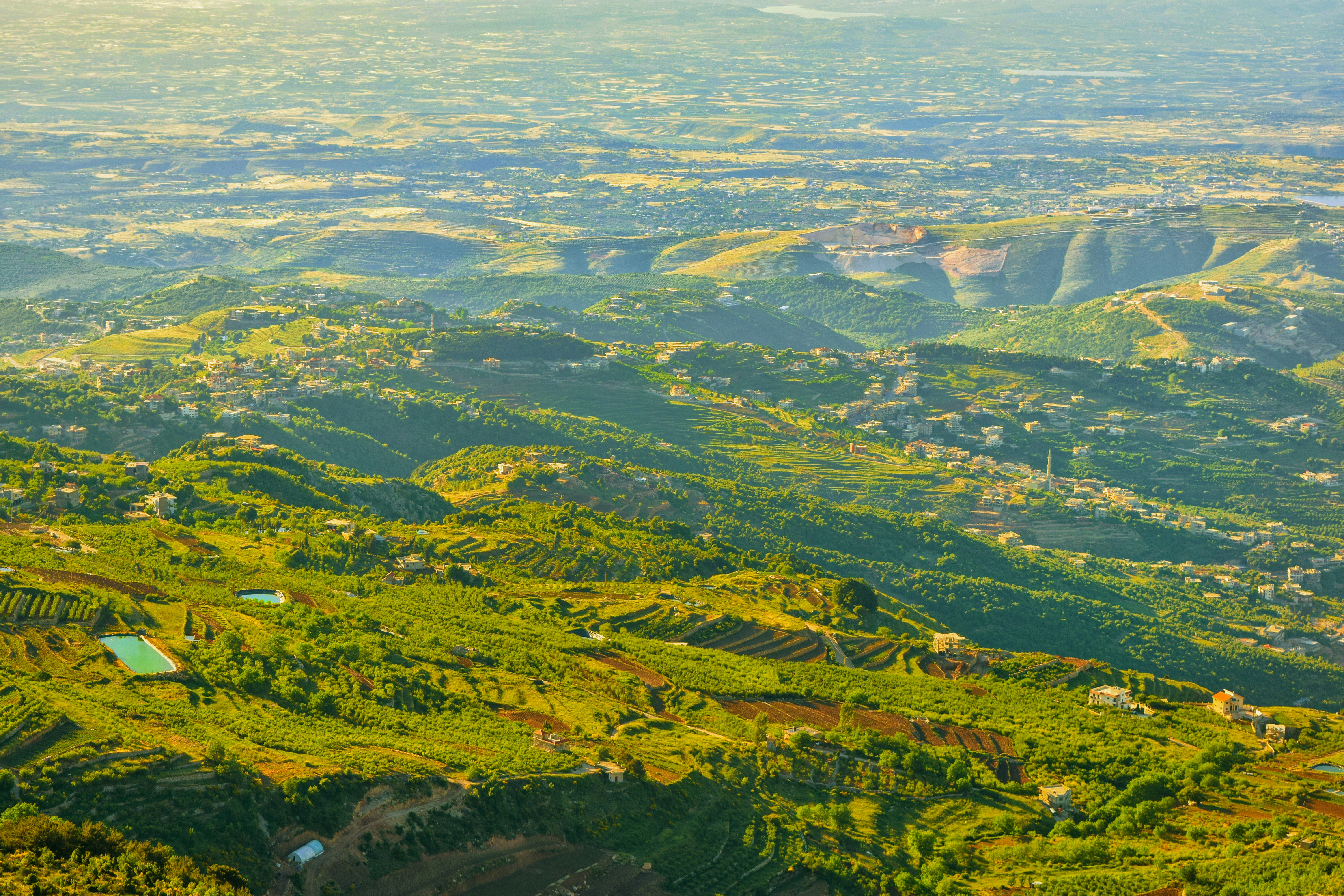 A beautiful hiking view over Aakkar El Aatiqa . | a landscape with trees and water