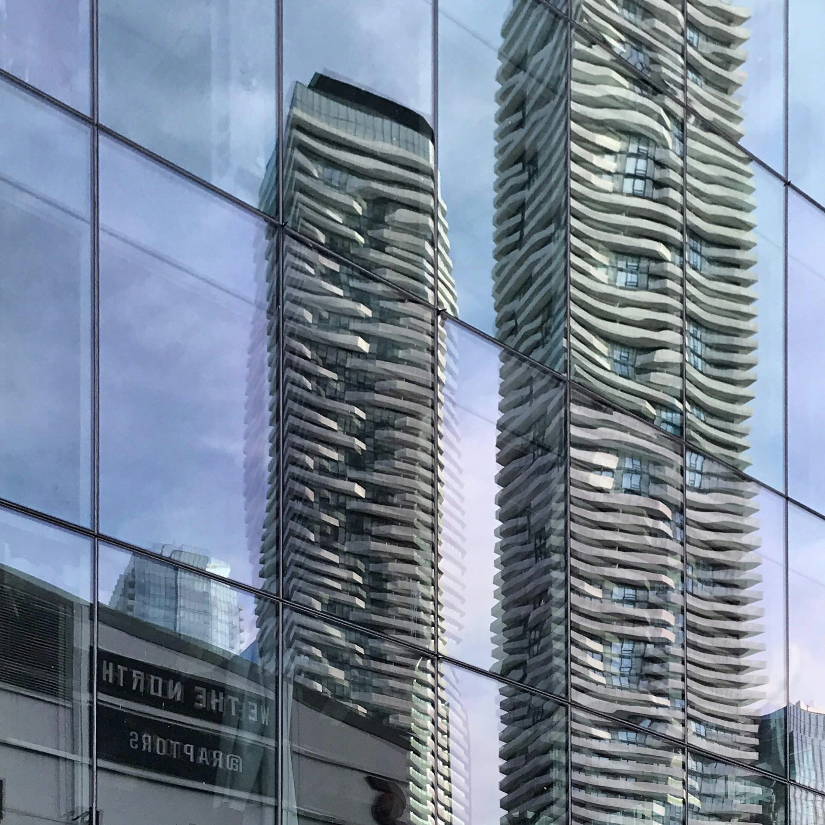 Distorted Twin: The Wavy Glass of Downtown Reflections