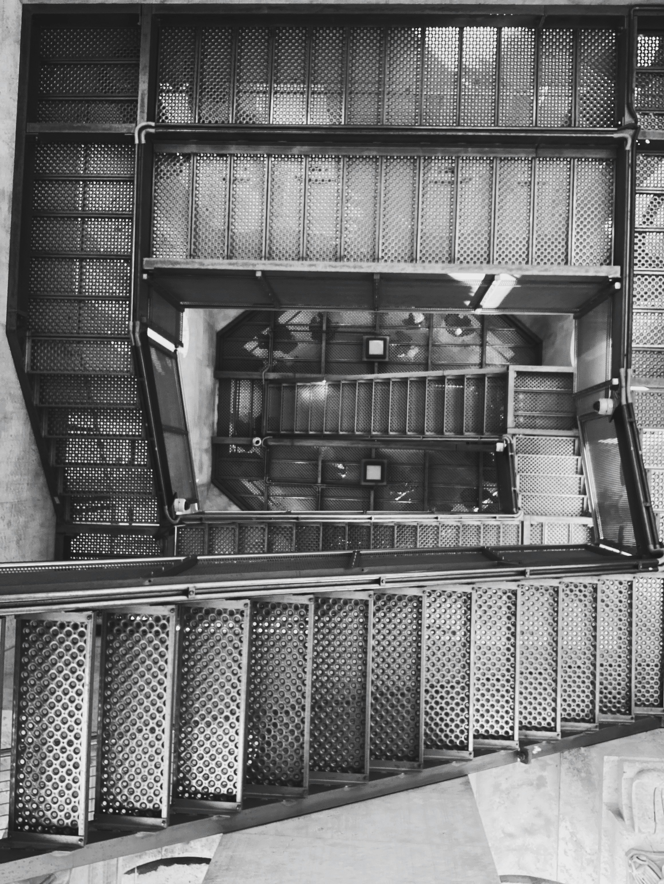 Endless Stairwell: A Spiral Descent into Steel and Light