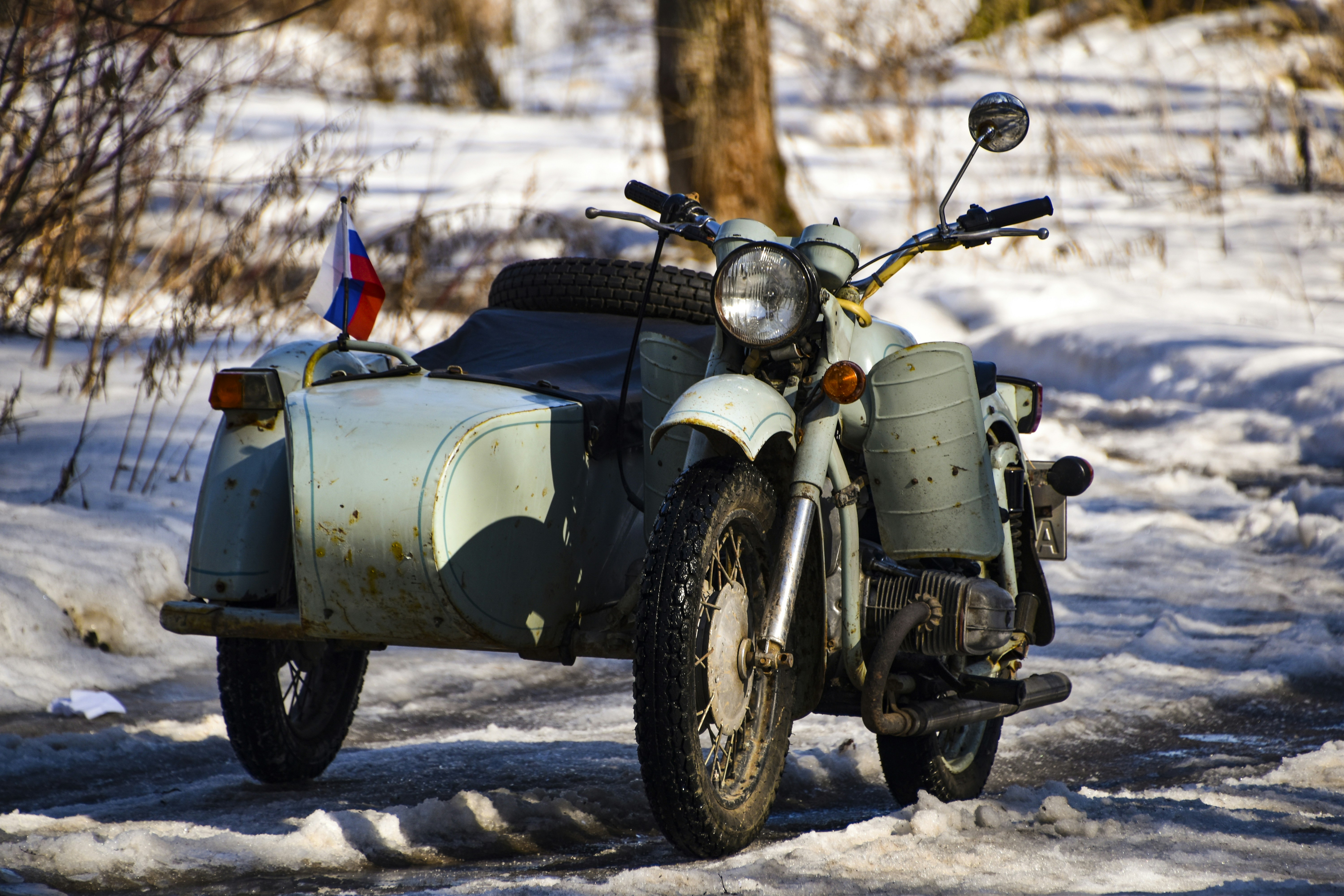 Winter Rest: Pale-blue Vintage Motorcycle with Sidecar in Frosty Light
