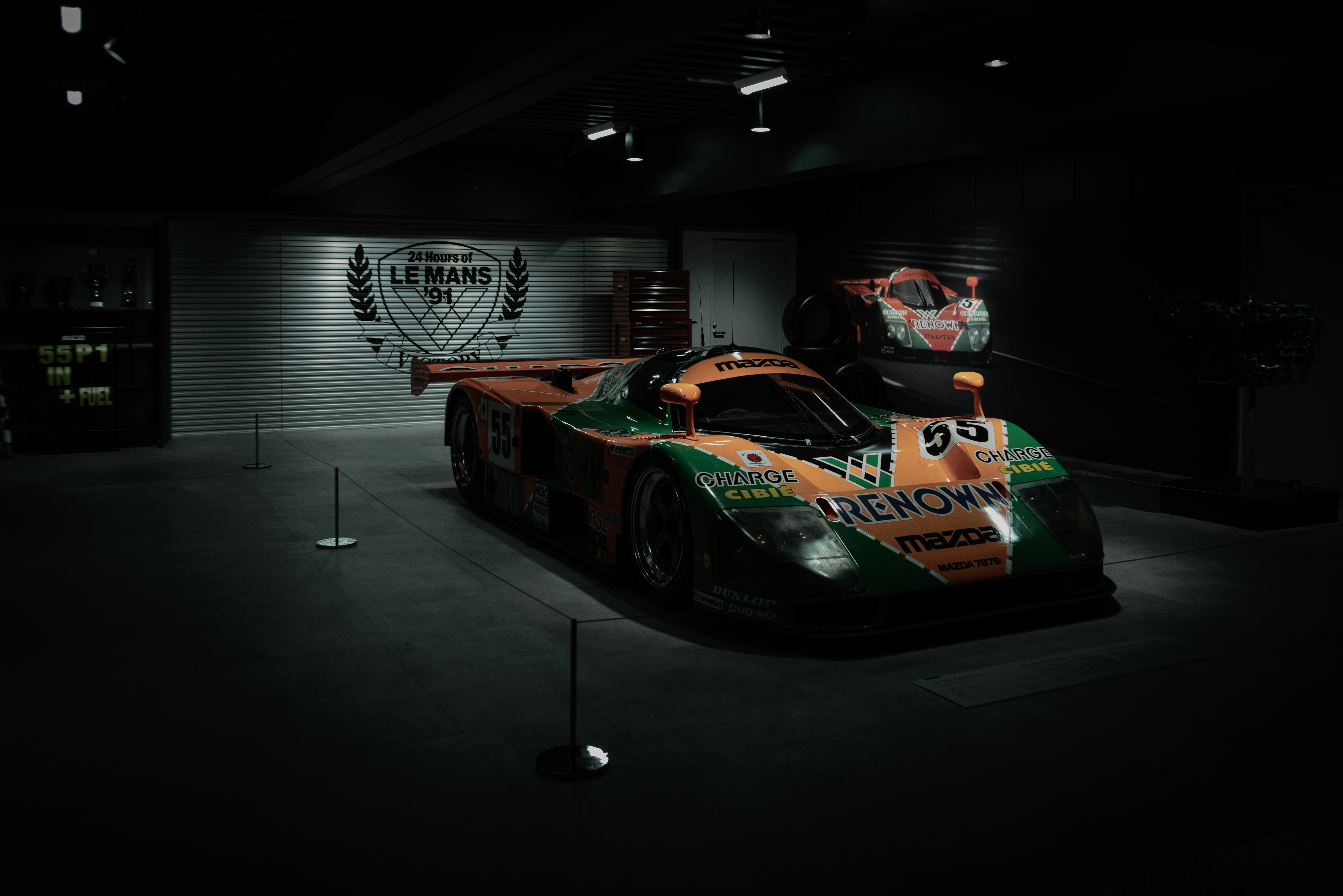 A race car parked in a garage photo – Free Car Image on Unsplash