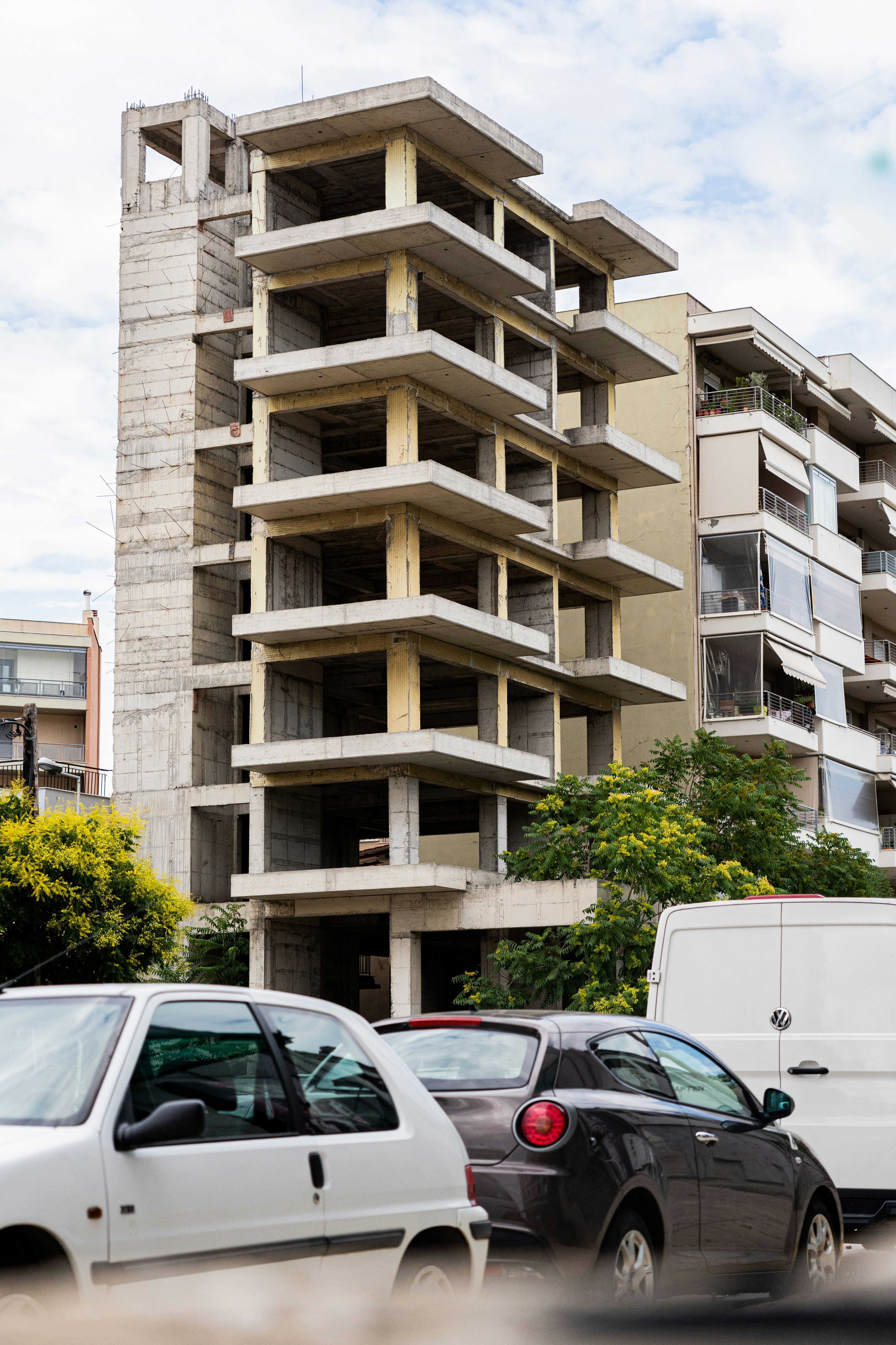 A building with cars parked in front photo – Free Thessaloniki Image on ...