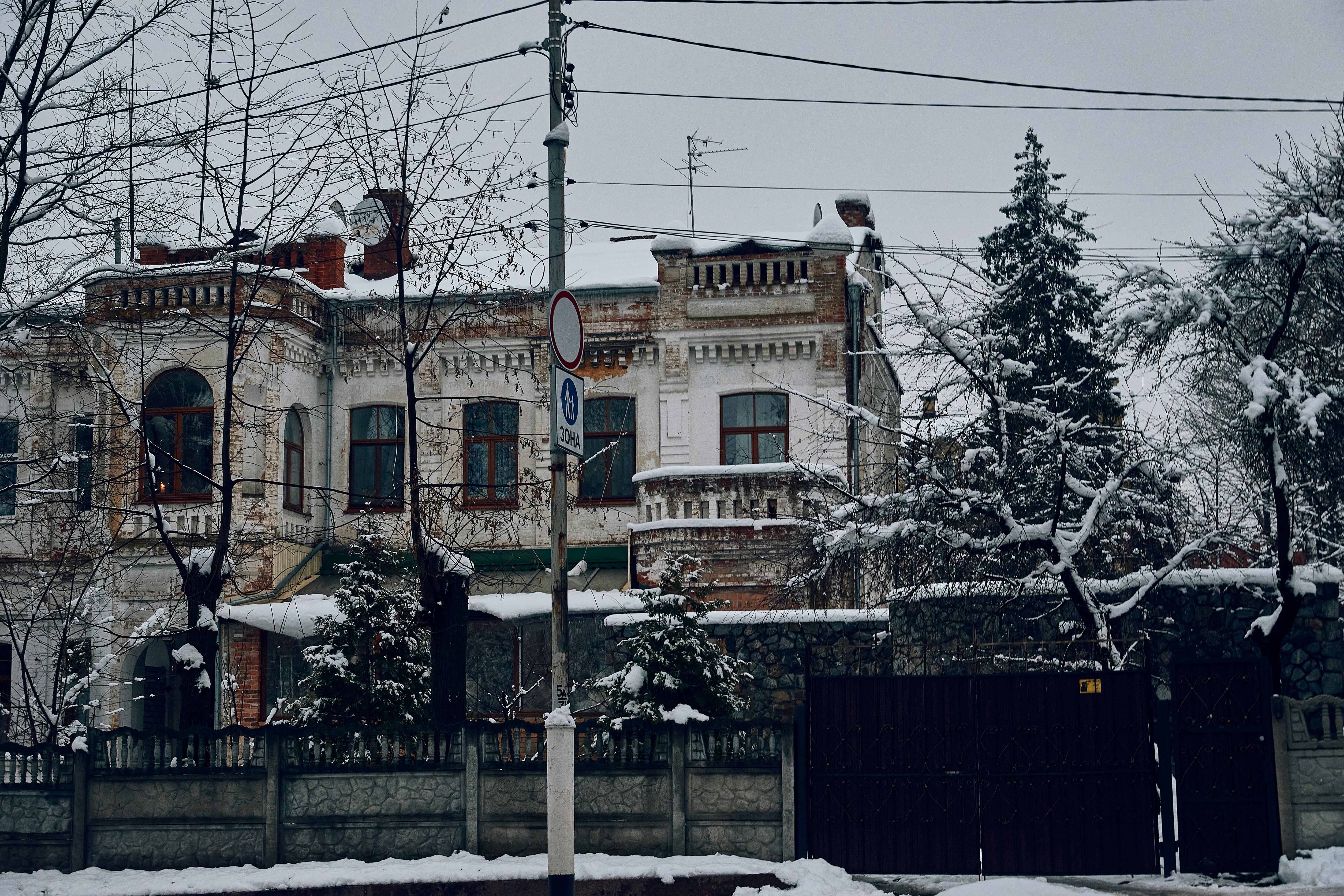 a large building with trees in front of it