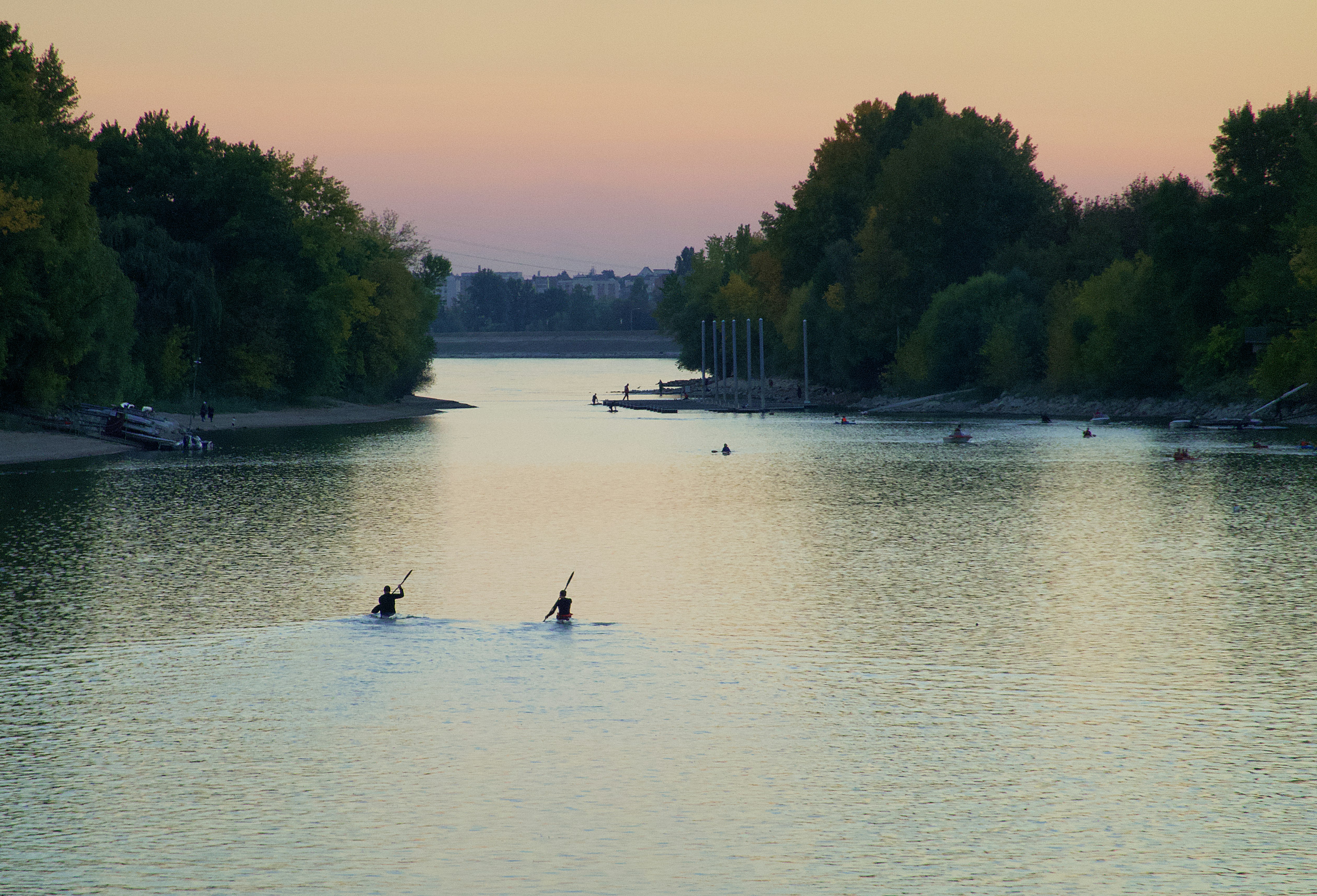 Dusk on the River: Two Rowers in Gentle Light
