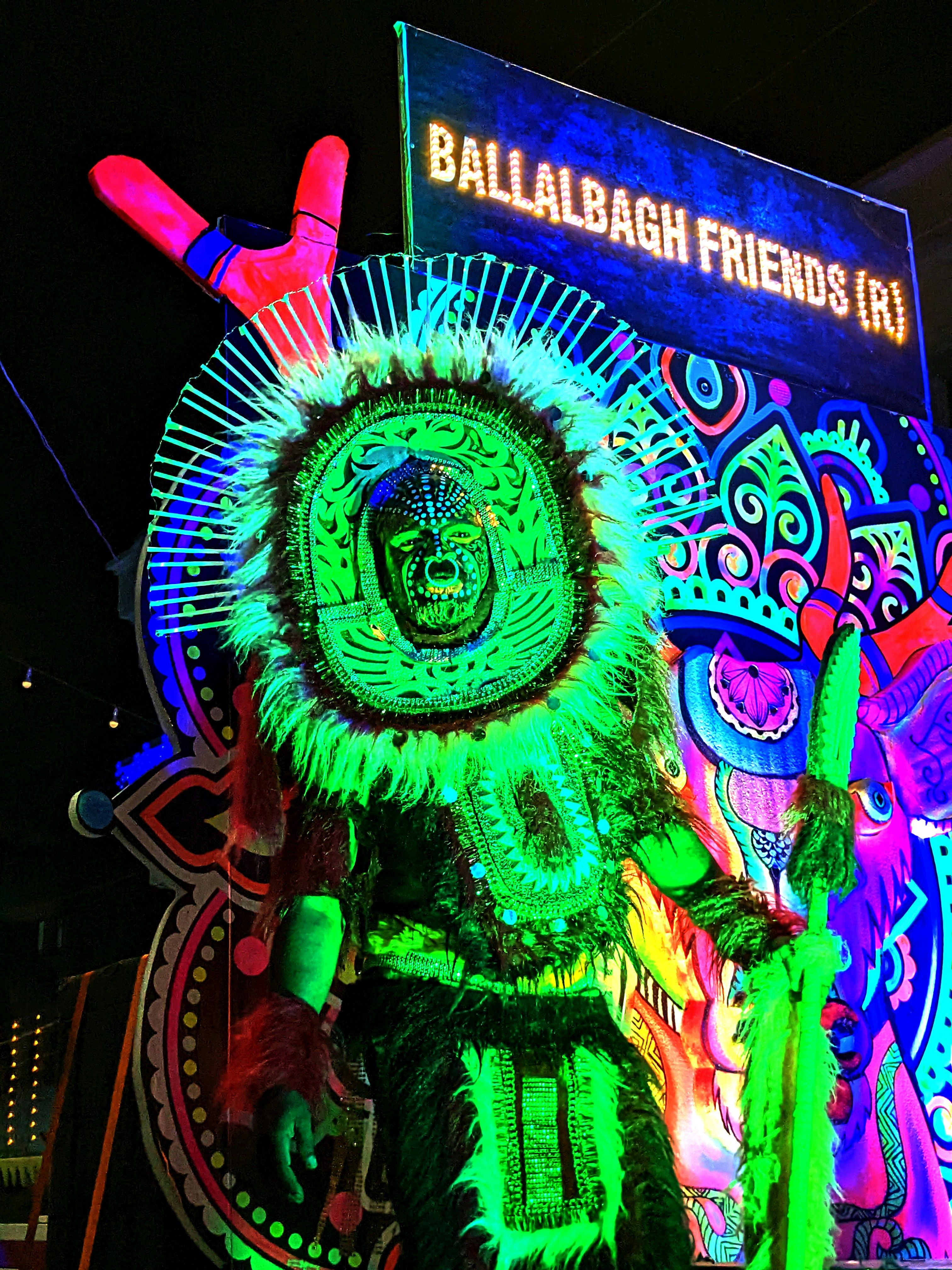 Vibrant Neon Spirit: A Festival Mask Emerges Under Night Lights