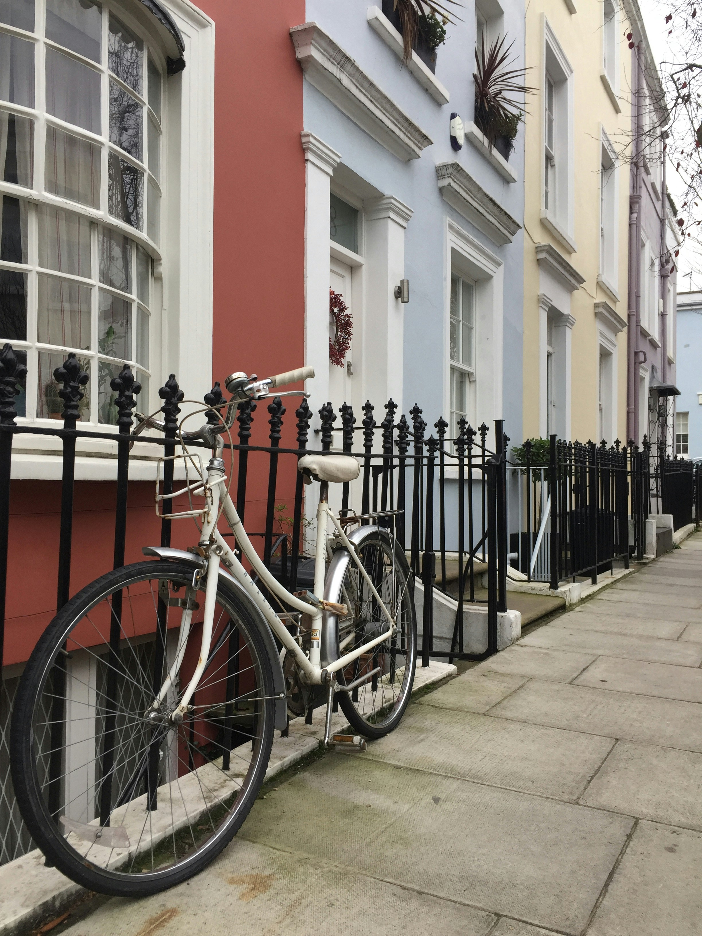 Bike chained to railings in Notting Hill, London.