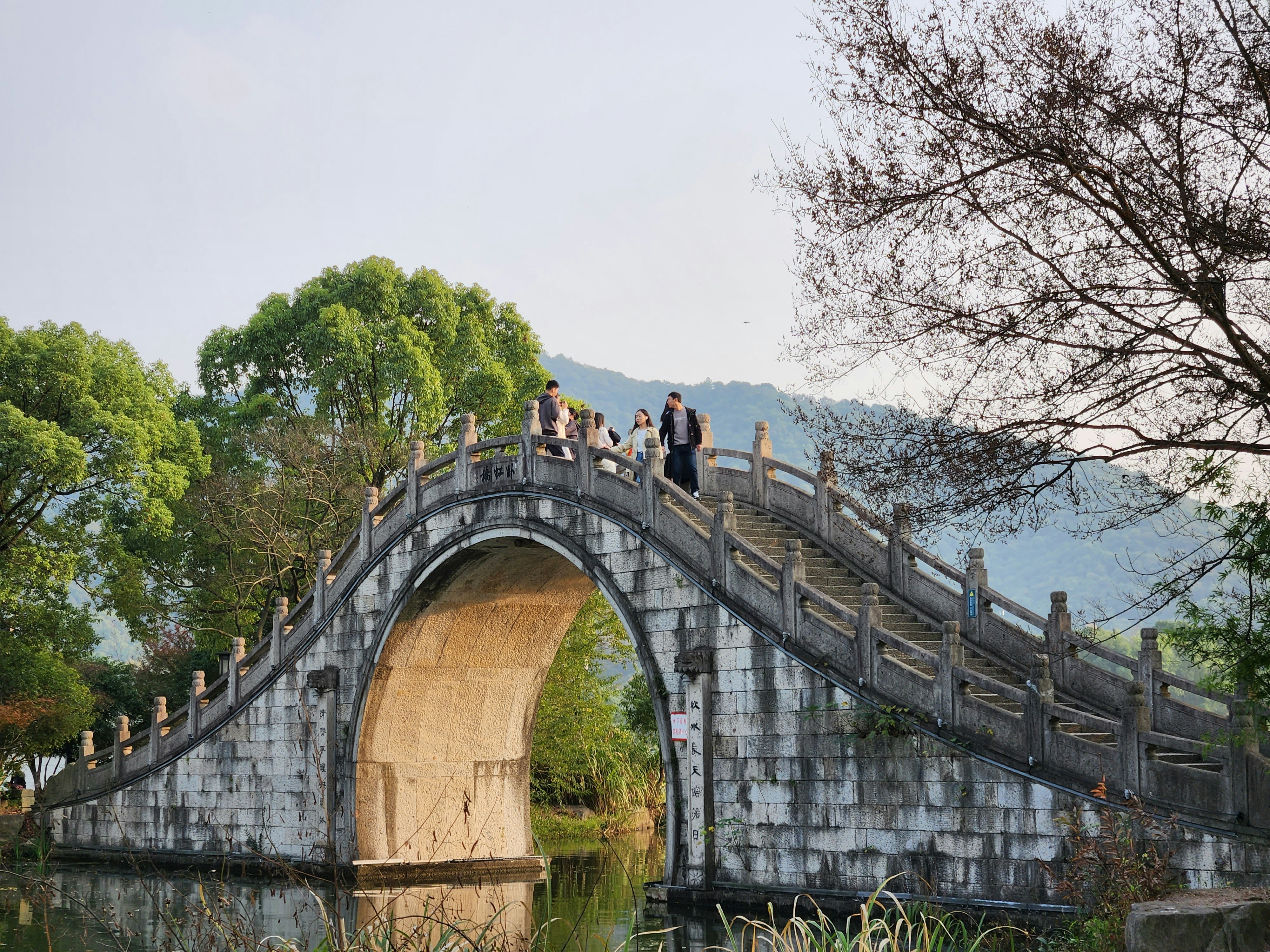 a group of people on a bridge
