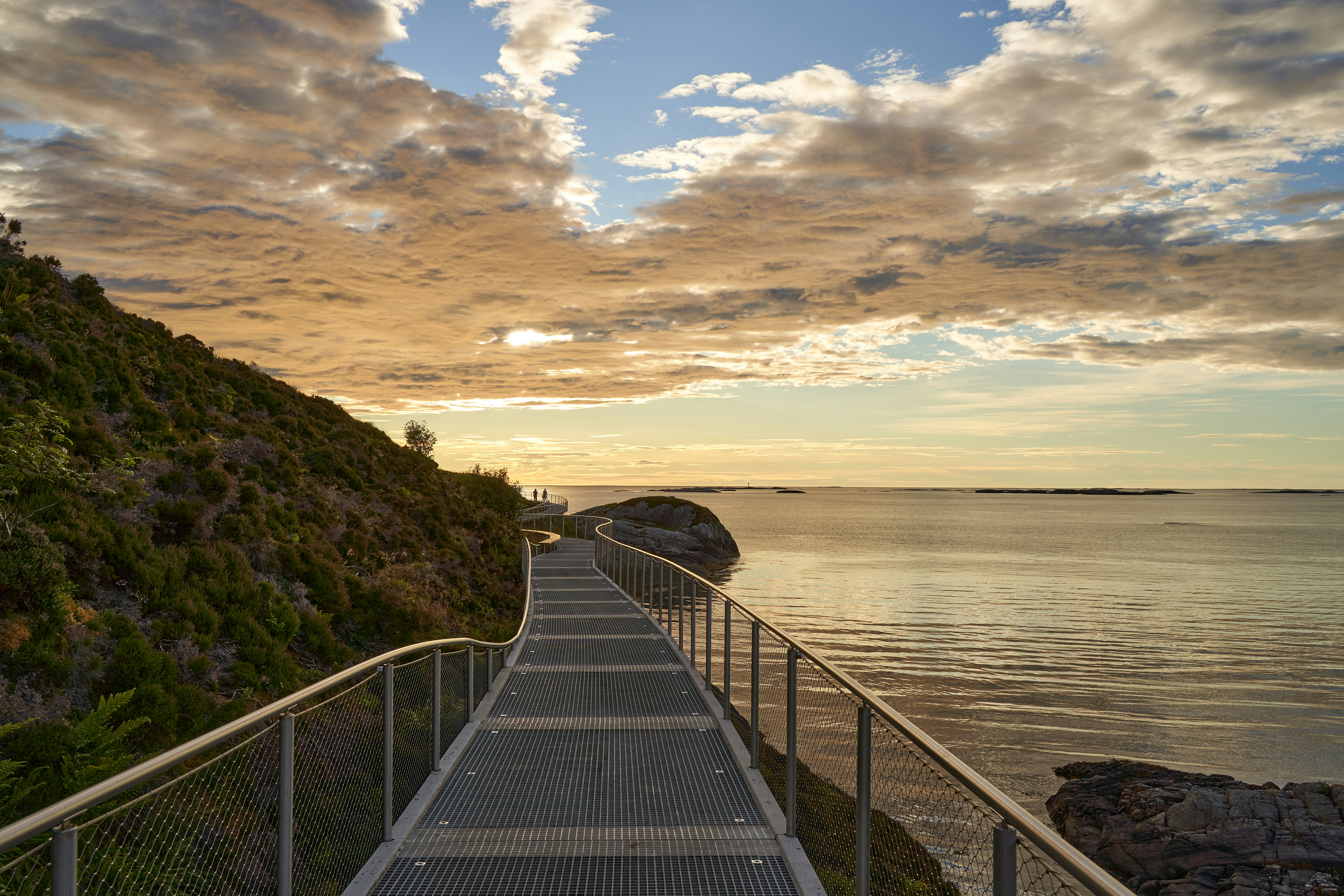 A walkway over a body of water photo – Free Sea Image on Unsplash