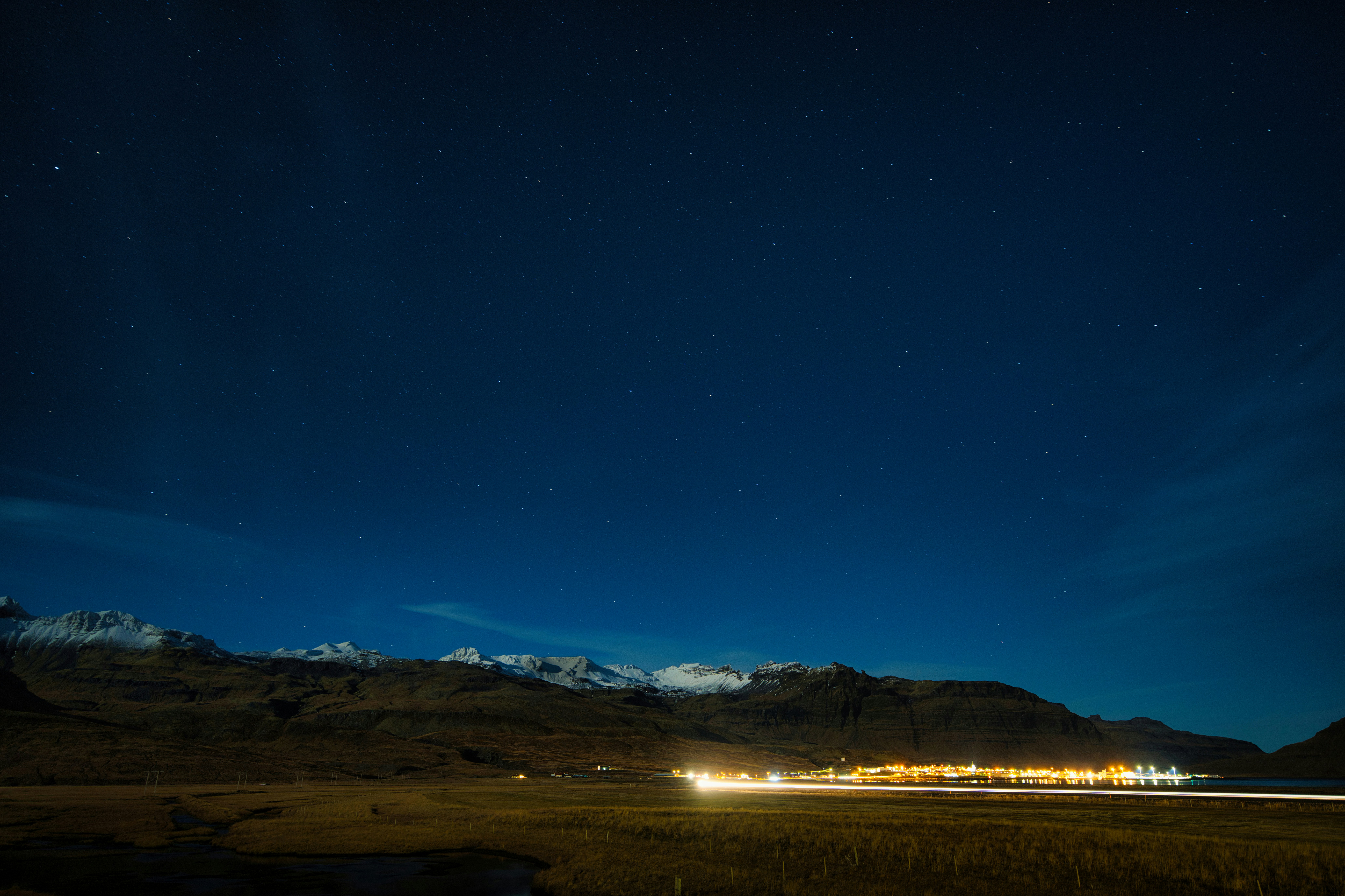Stellar Ridge Over a Quiet Plain: Starry Sky and Light Trails