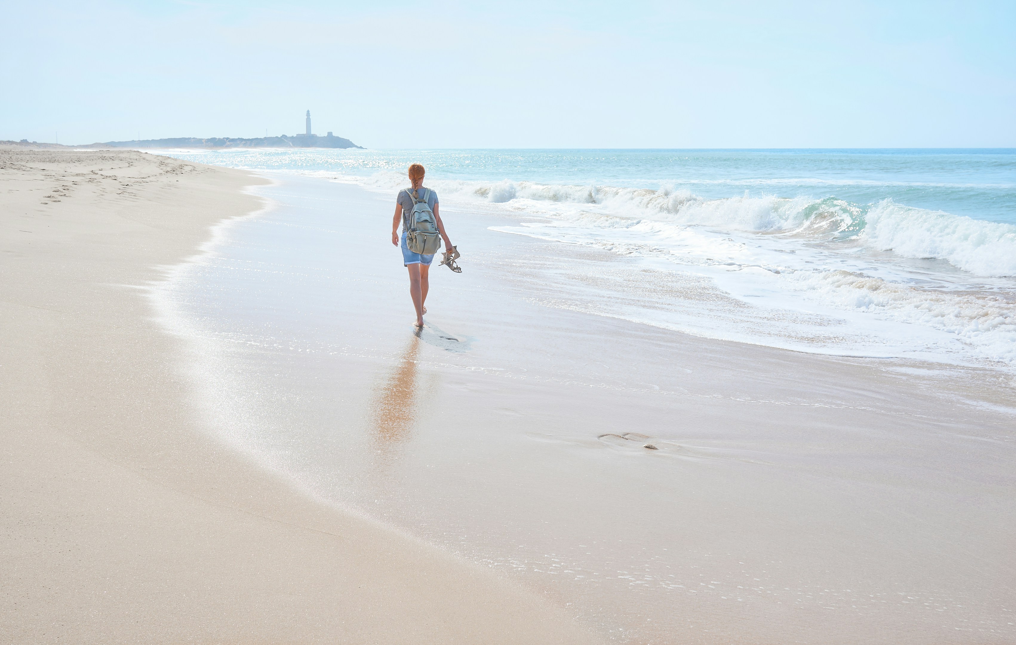 A person walking on a beach photo – Free Spain Image on Unsplash