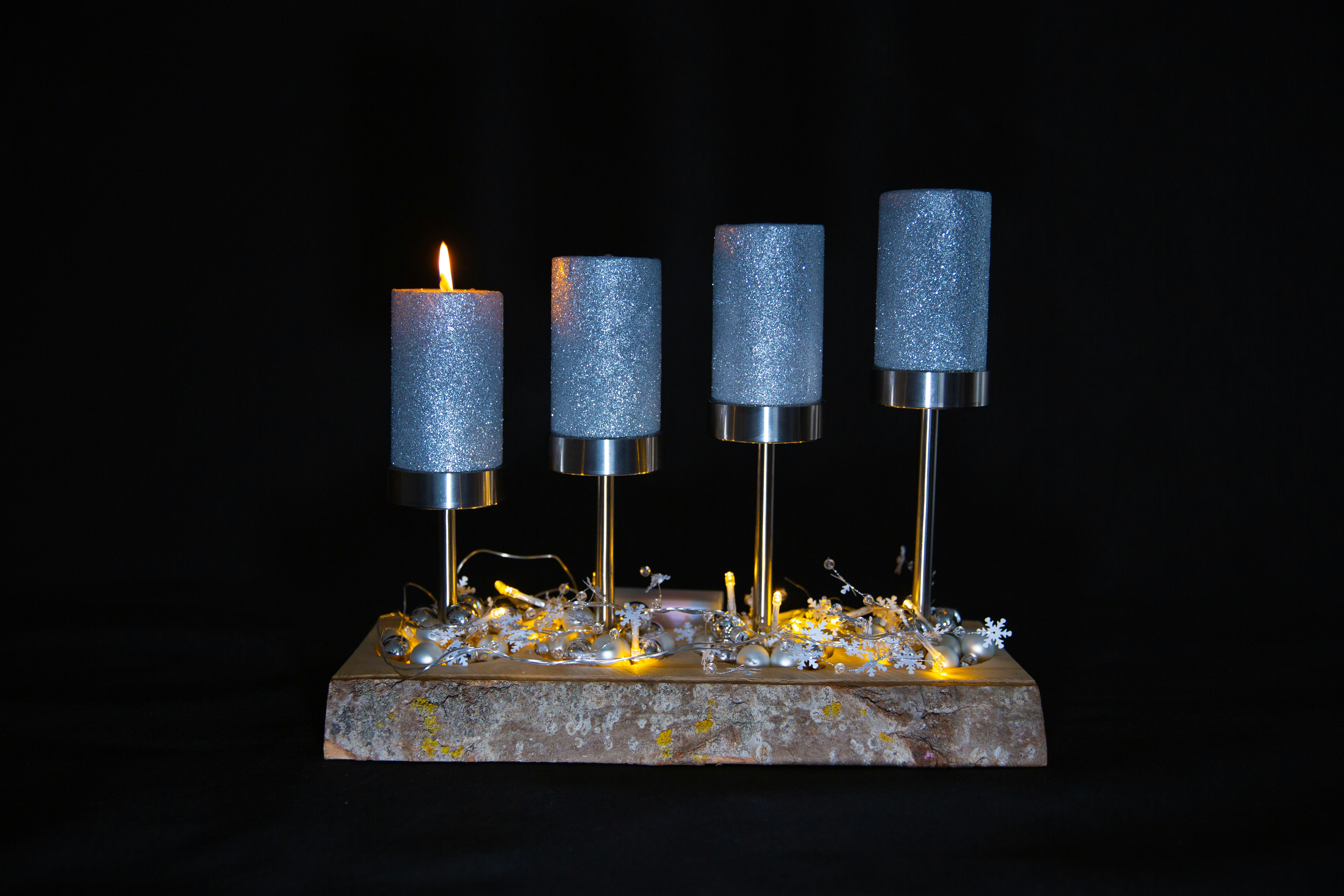 Four Candlelit Wisps: A Quiet Tableau of Light and Texture