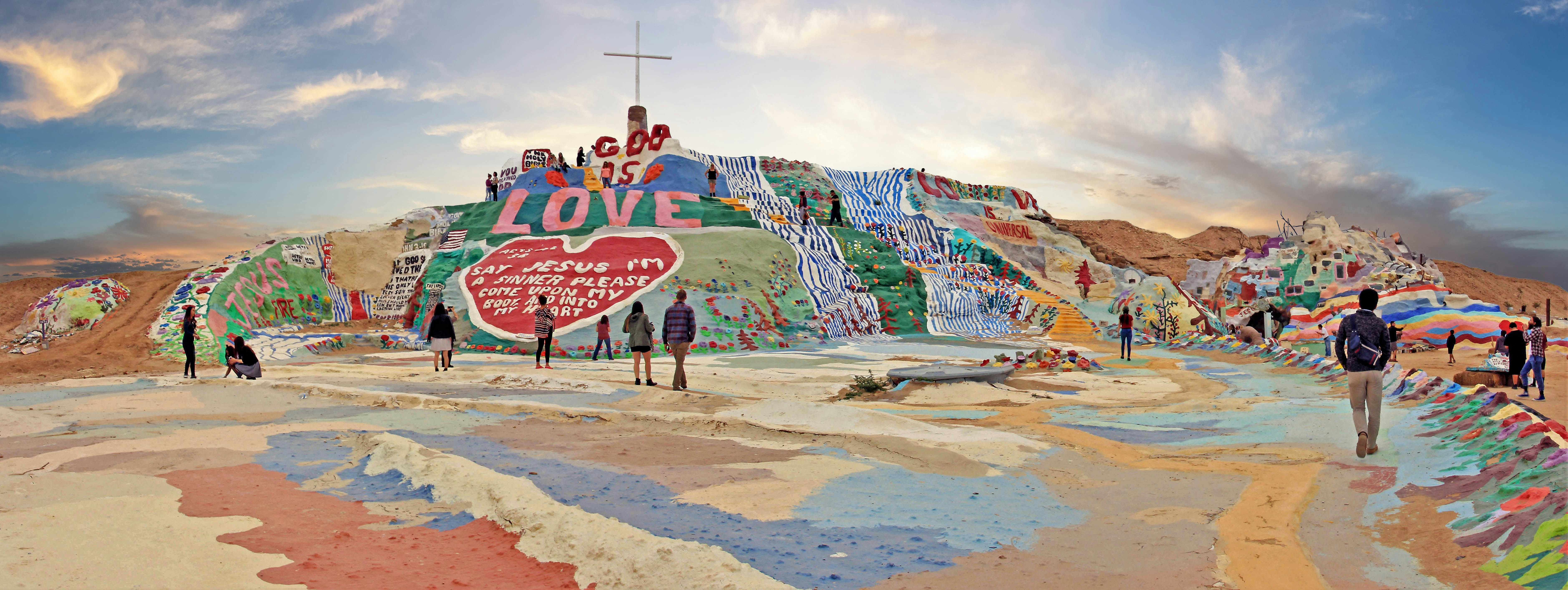 Vivid Mosaic Cliff: A Playa of Color under a Golden Sky