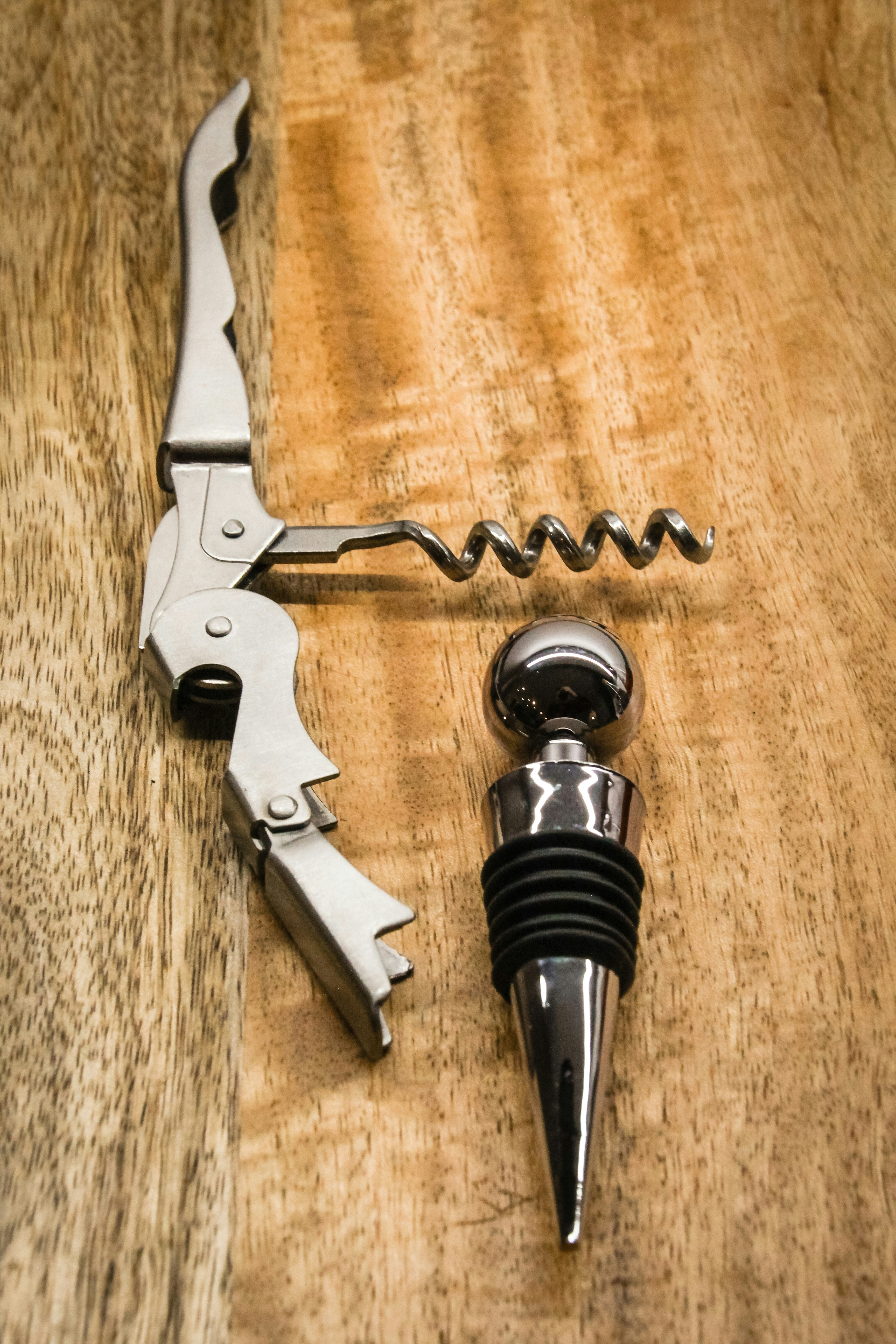 a corkscrew and wine bottle stop