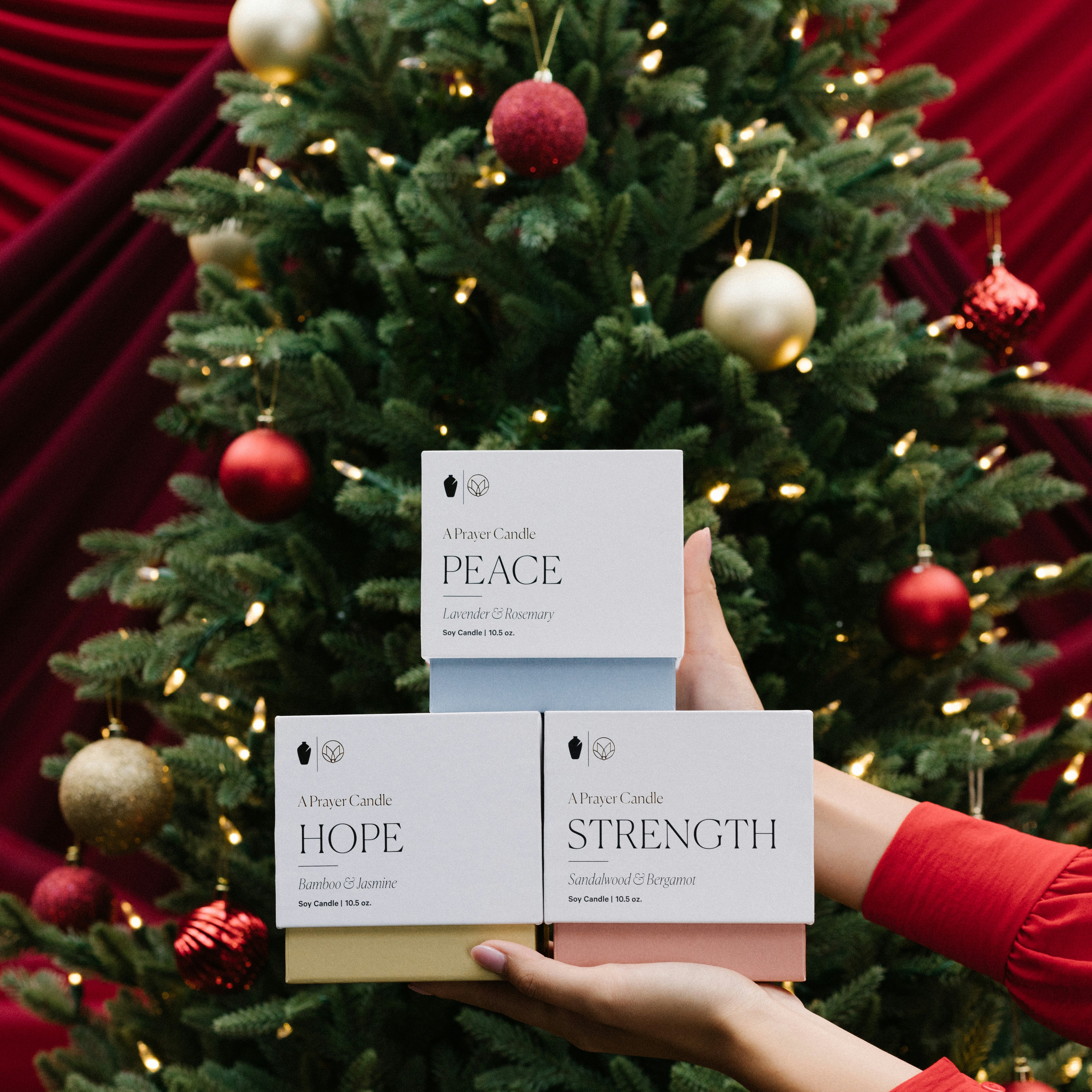 Gifting Serenity: A Minimalist Candle Trio Beneath a Festive Tree