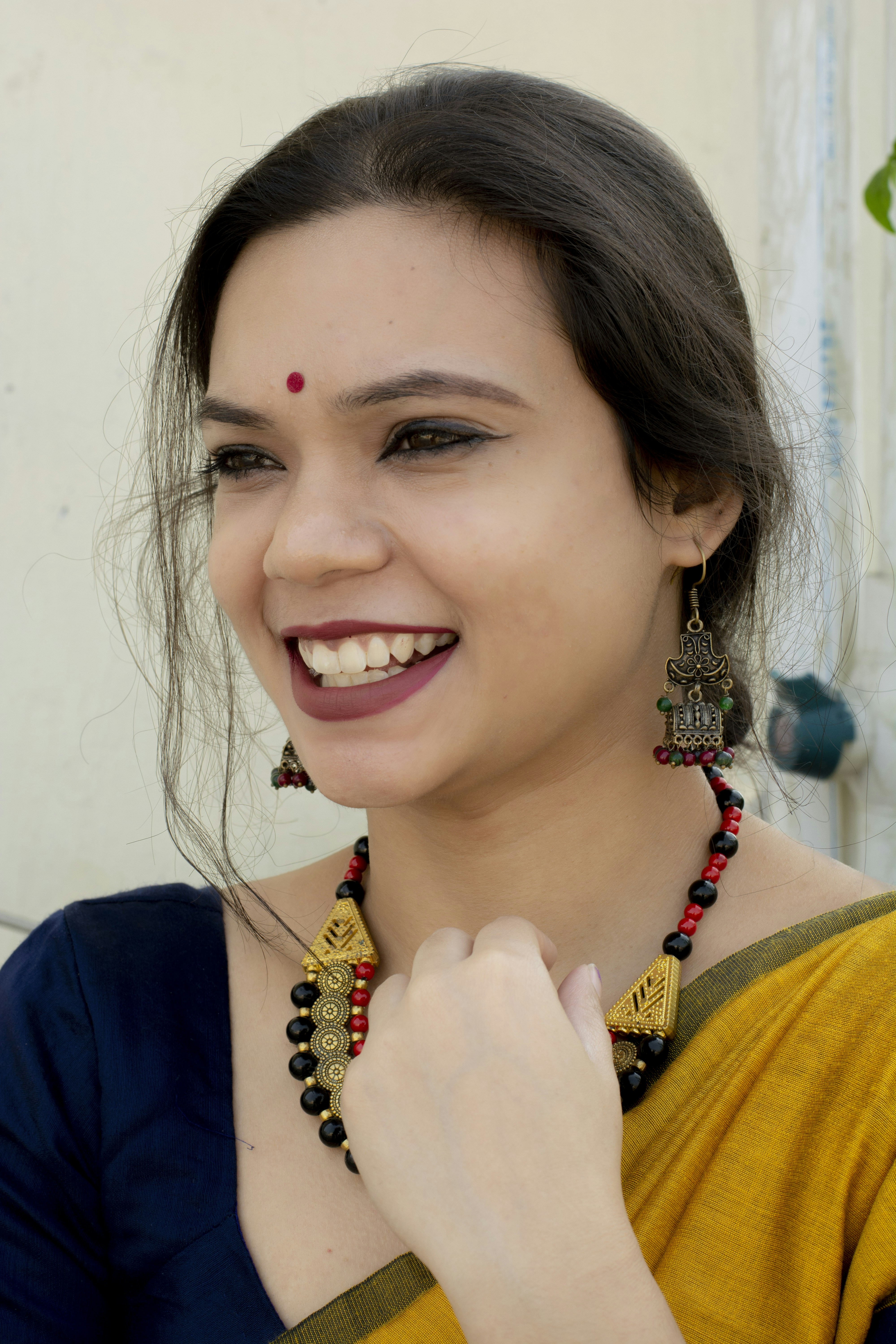 A woman smiling with her hand on her chin photo – Free West bengal ...