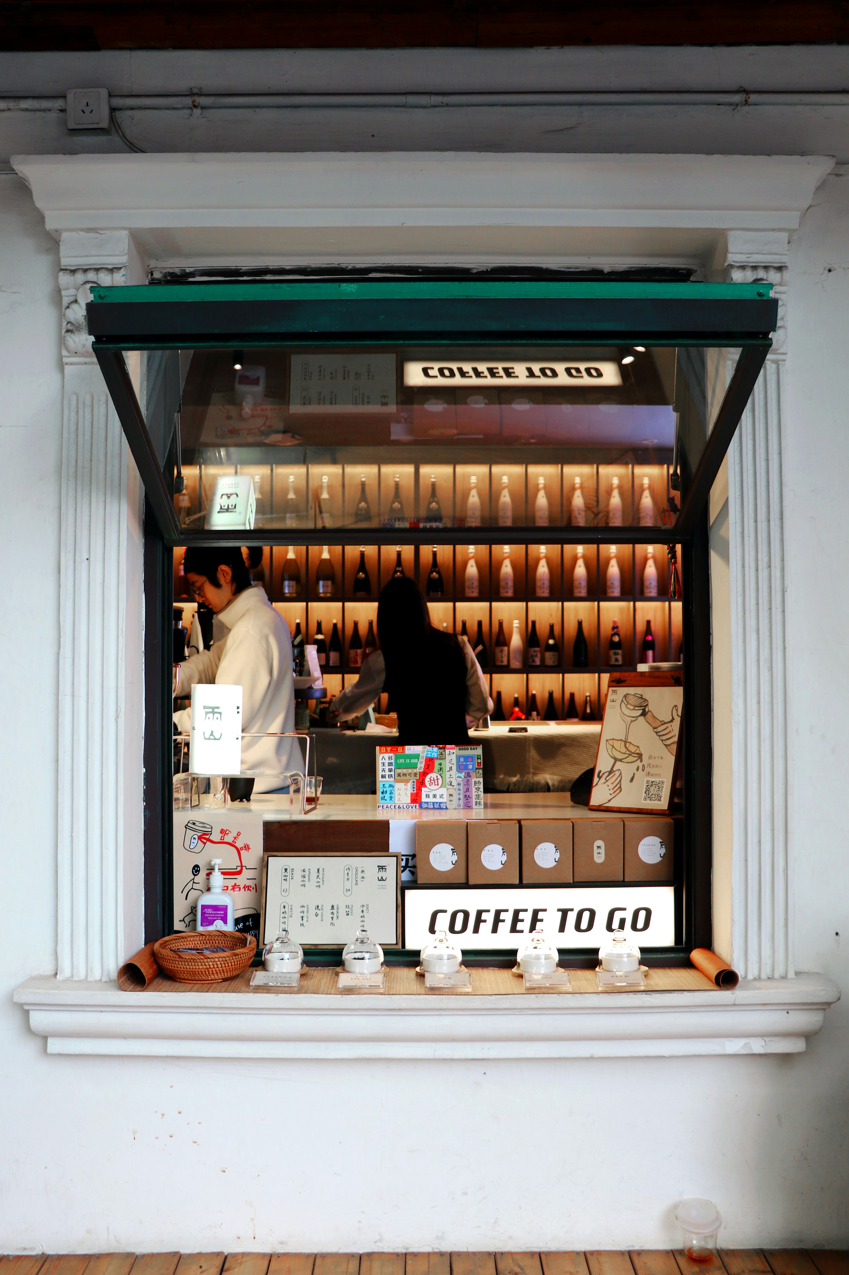 A store window with a display of alcohol photo – Free Coffee bar Image ...