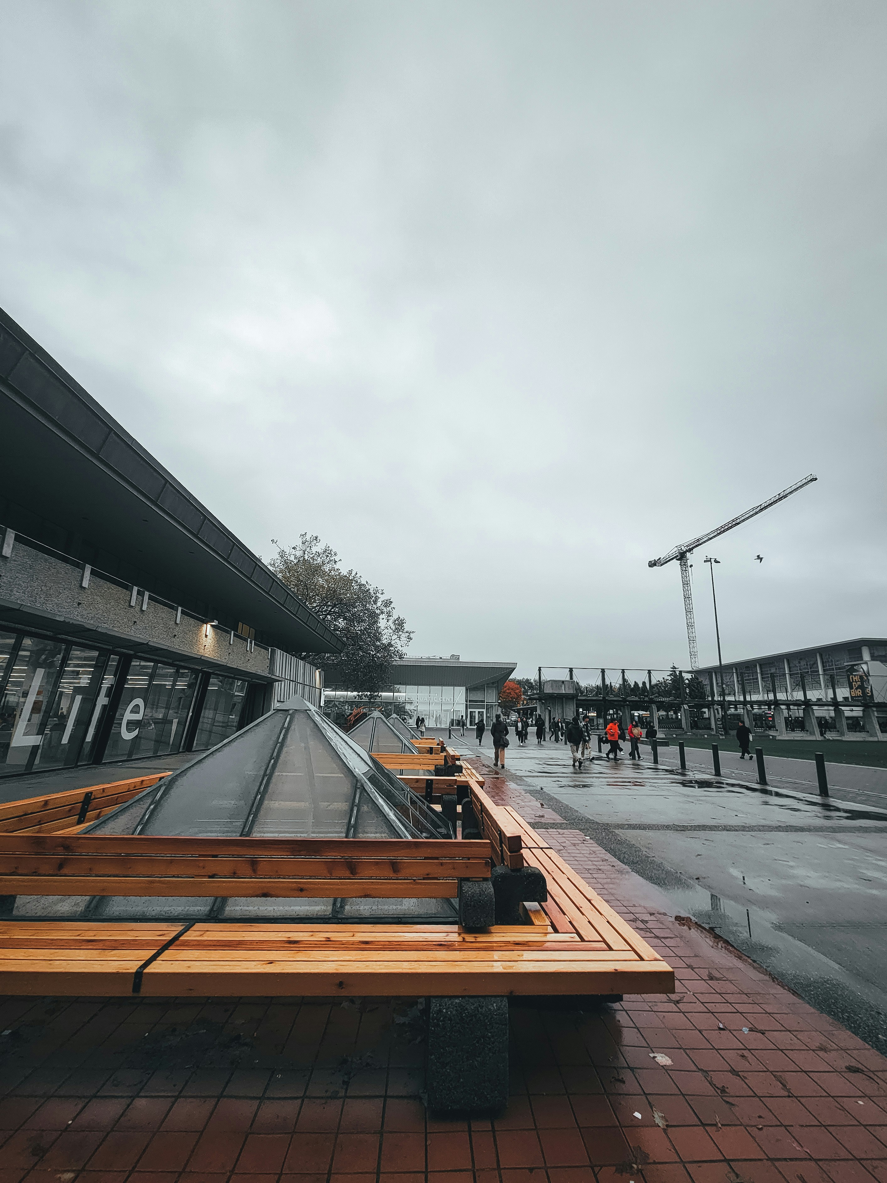 A building with a crane in the background photo – Free Ubc bus loop ...