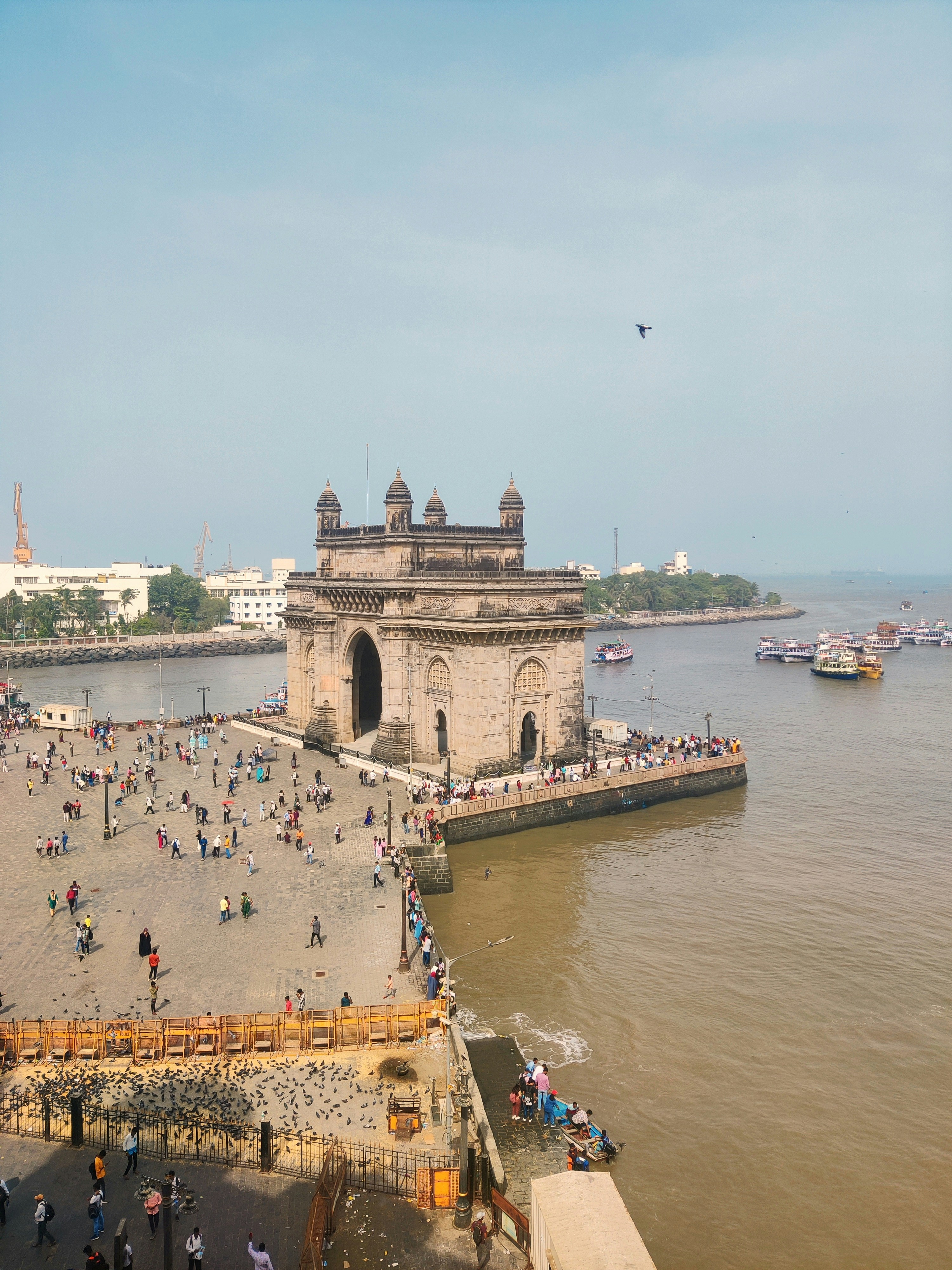 A crowd of people at a waterfront photo – Free Gateway of india mumbai ...