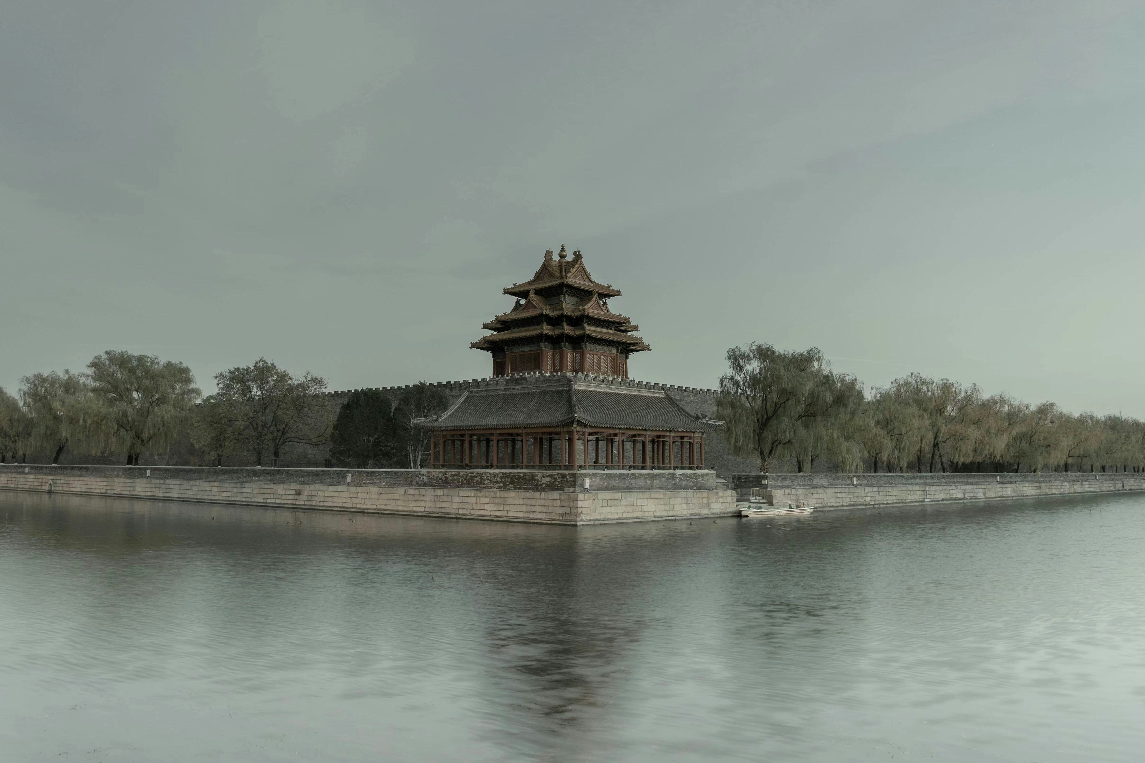 A building with a large tower by a body of water photo – Free Beijing ...