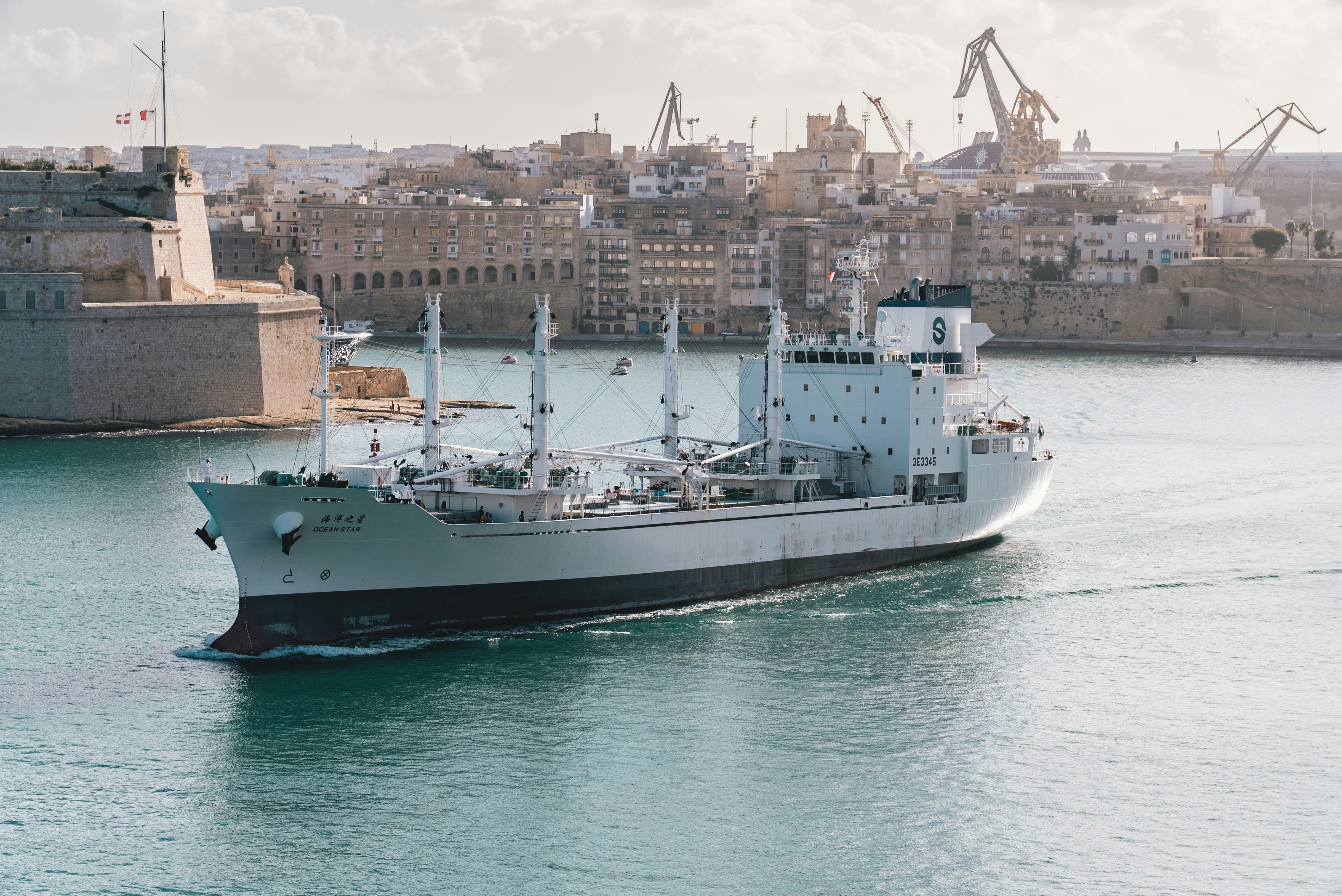 Bulk Carrier in Maltese Harbor: Industrial Calm Against a Turquoise Tide