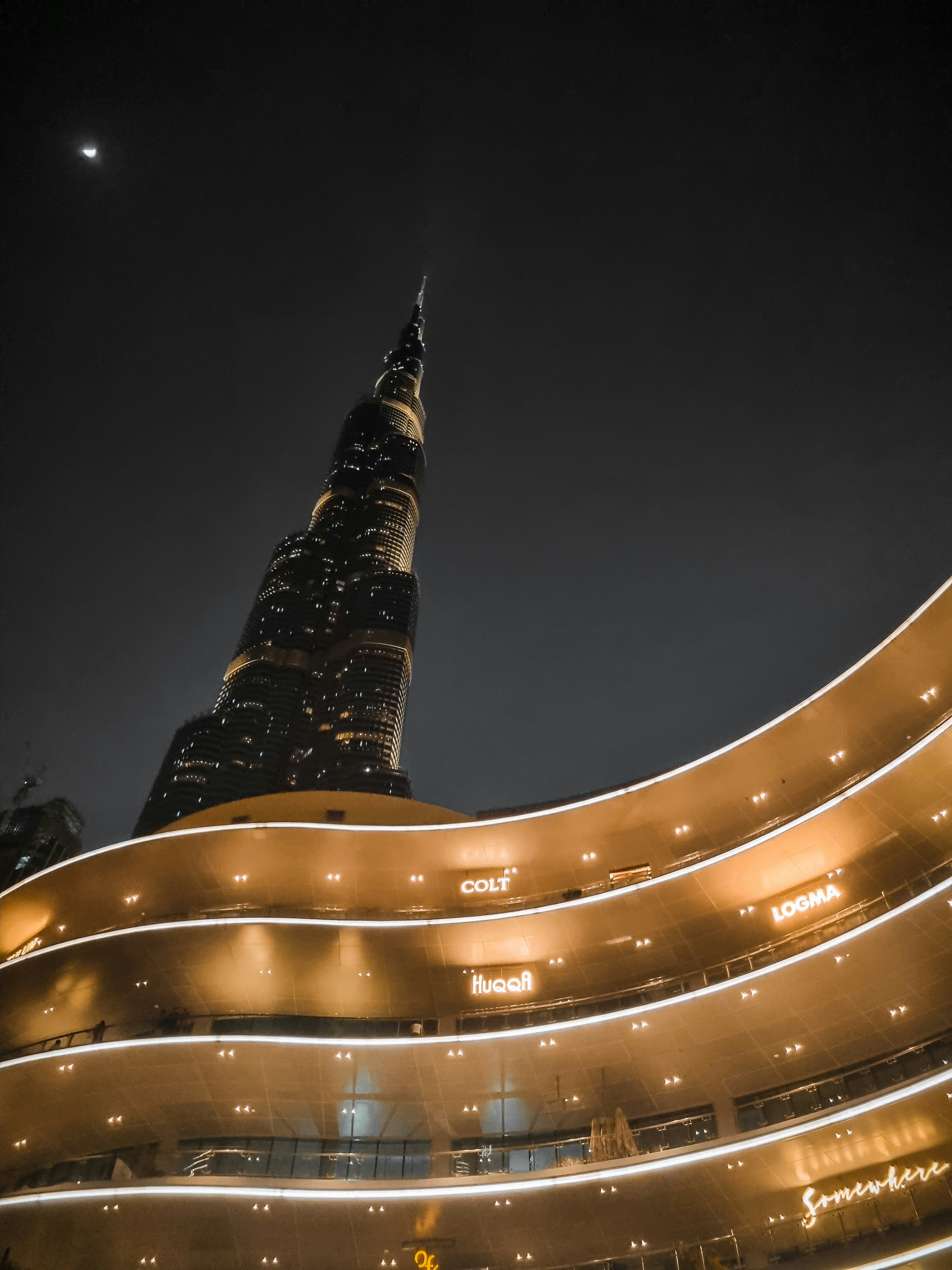 Spire Against Golden Waves: Burj Khalifa at Dubai Night Glow